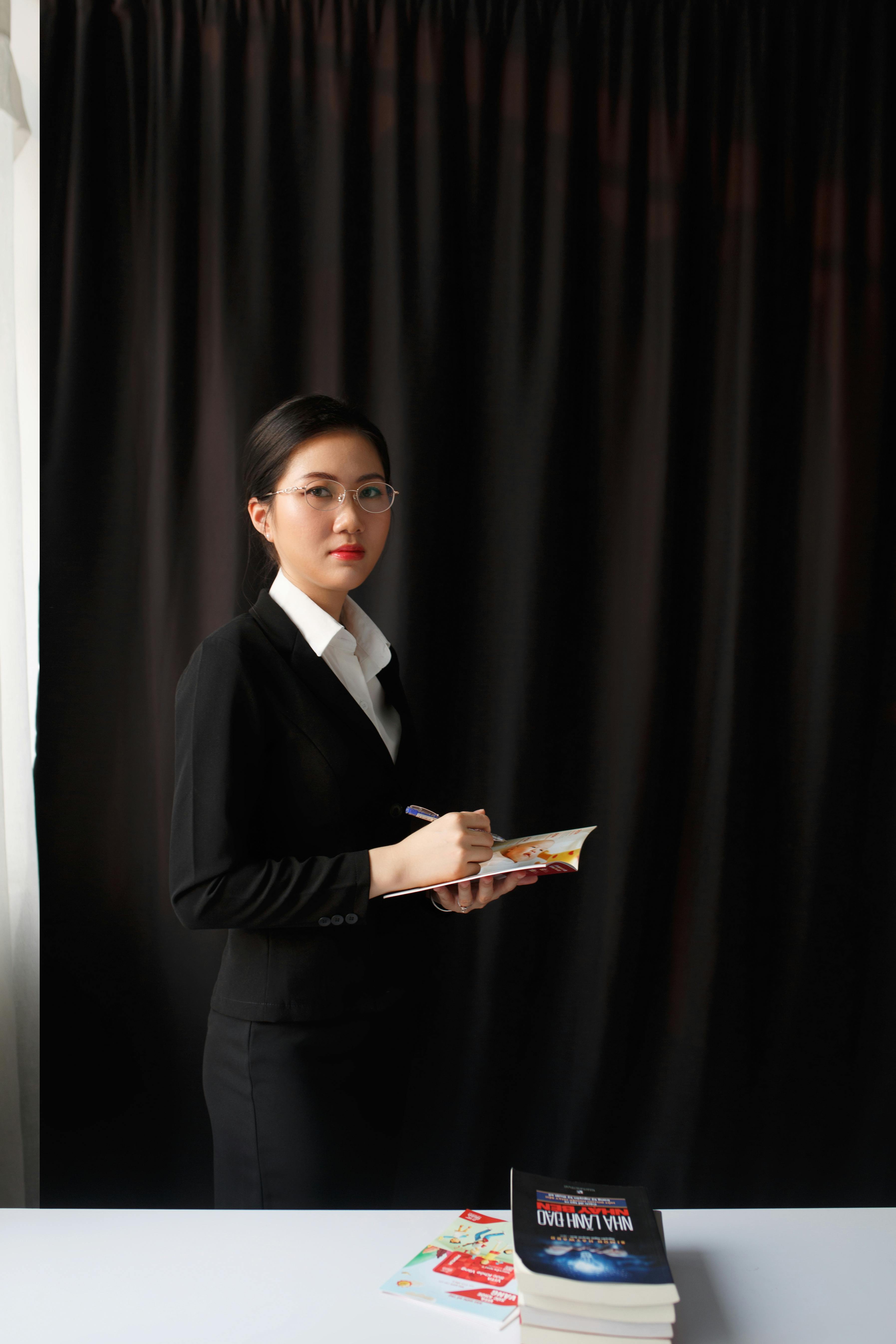 Woman Crouching Next to the Wheel of a New Audi Car · Free Stock Photo