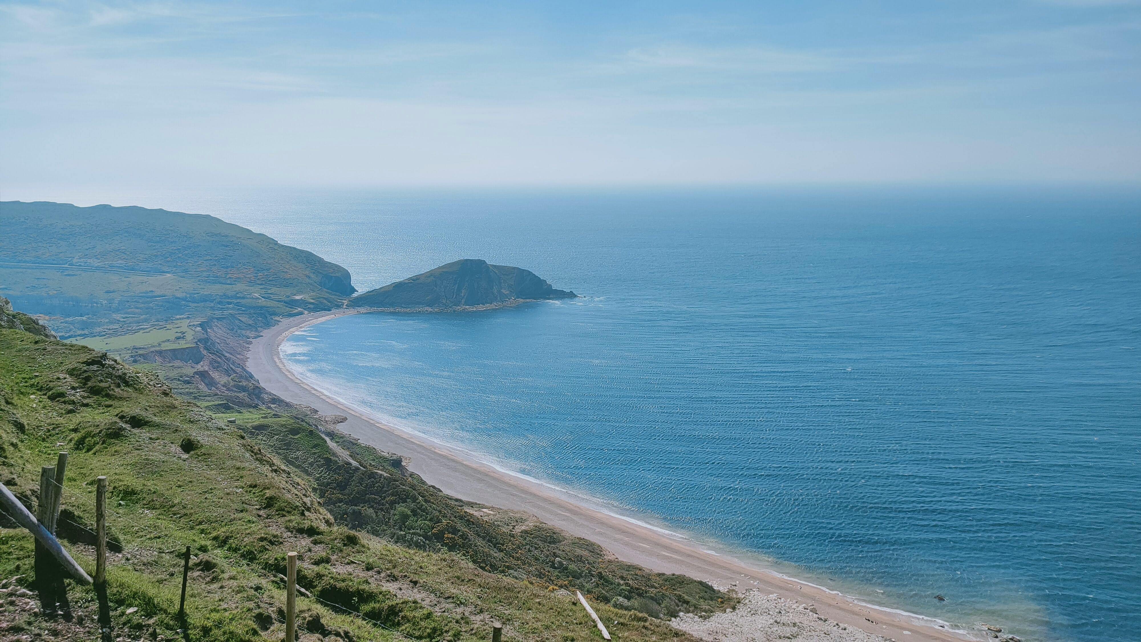 Grassy Hill by the Sea · Free Stock Photo