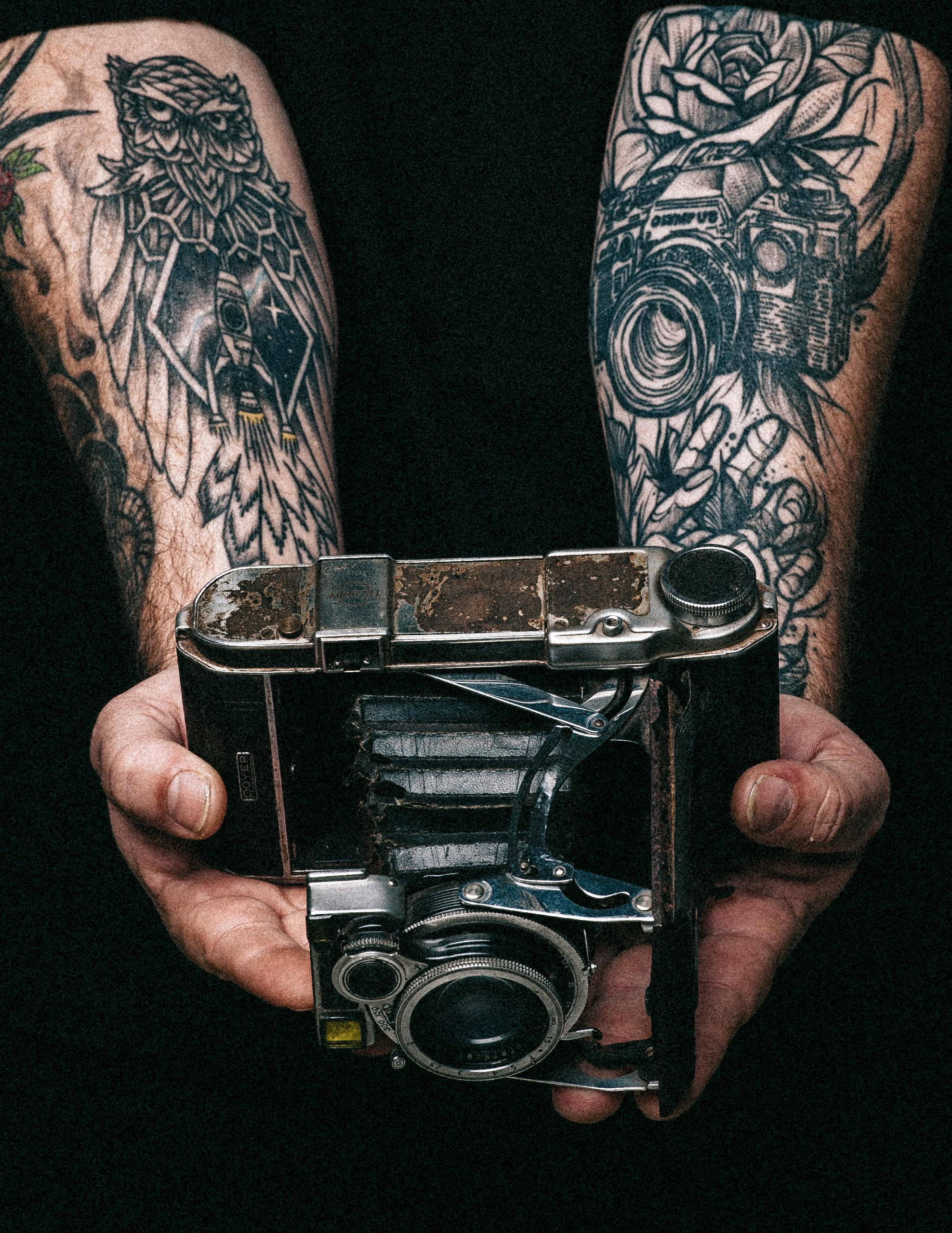 Man Holding Vintage Camera · Free Stock Photo