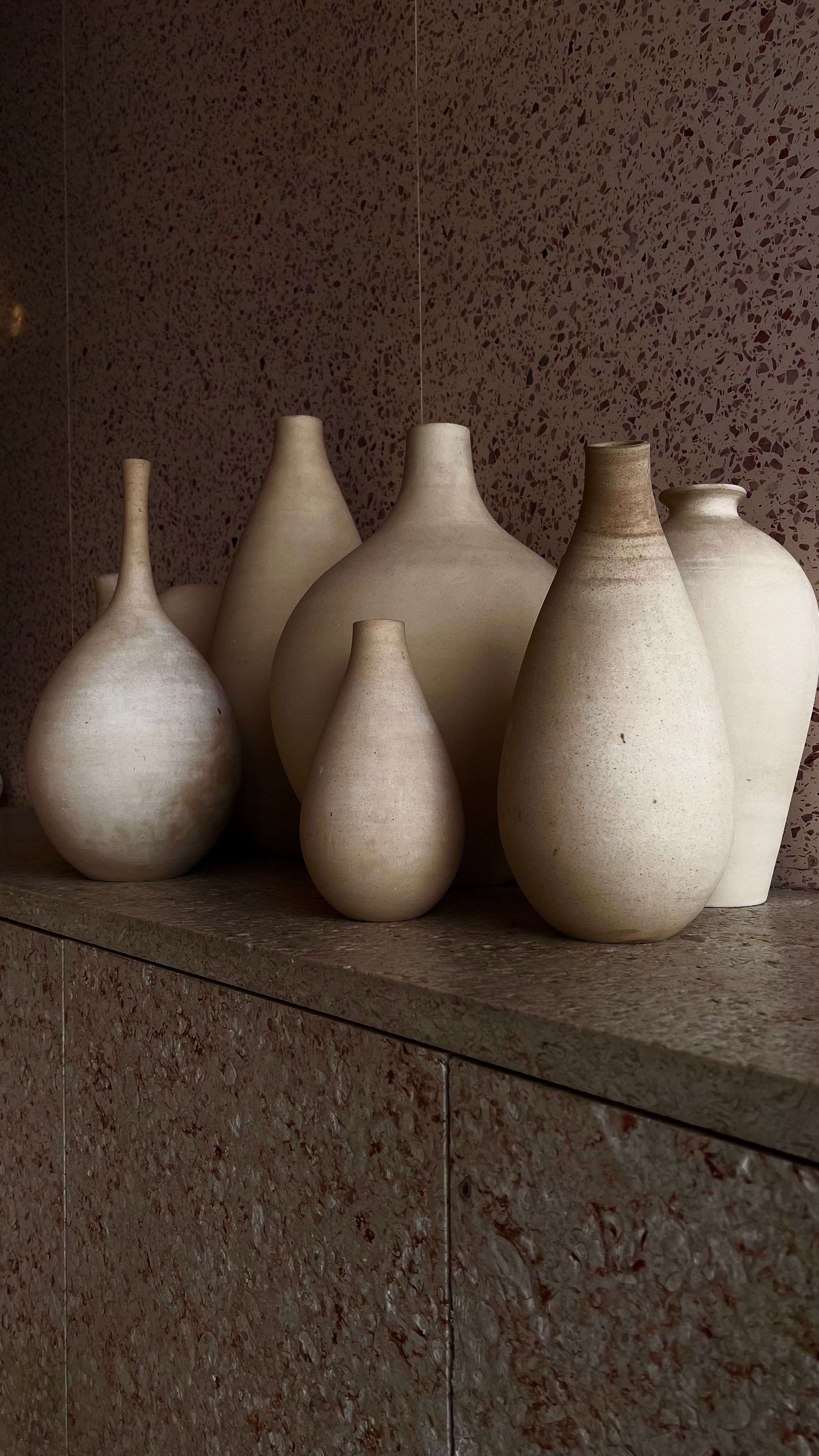 Clay Vases Set on Stone Table · Free Stock Photo