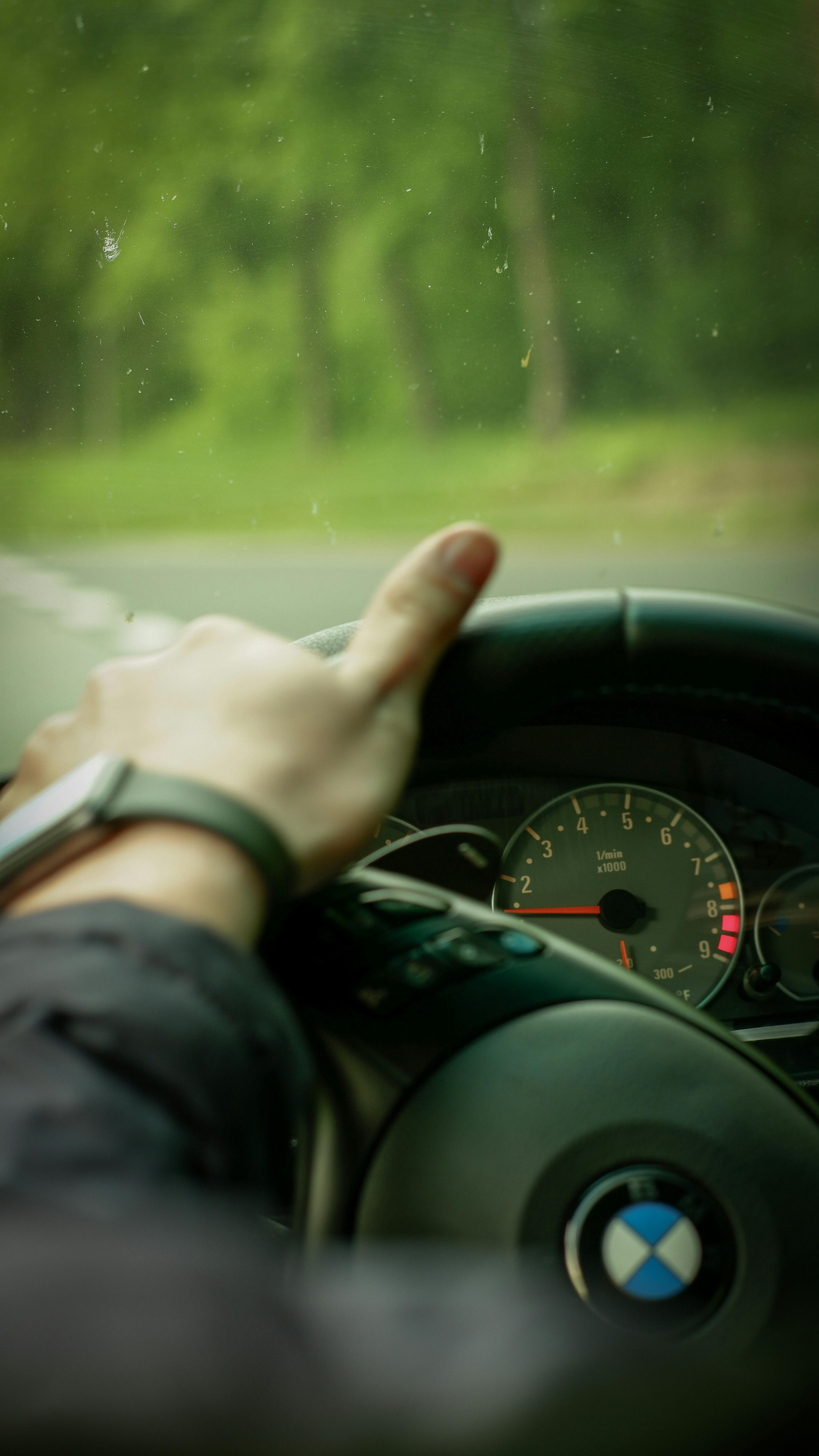 Man Hand on BMW Steering Wheel · Free Stock Photo
