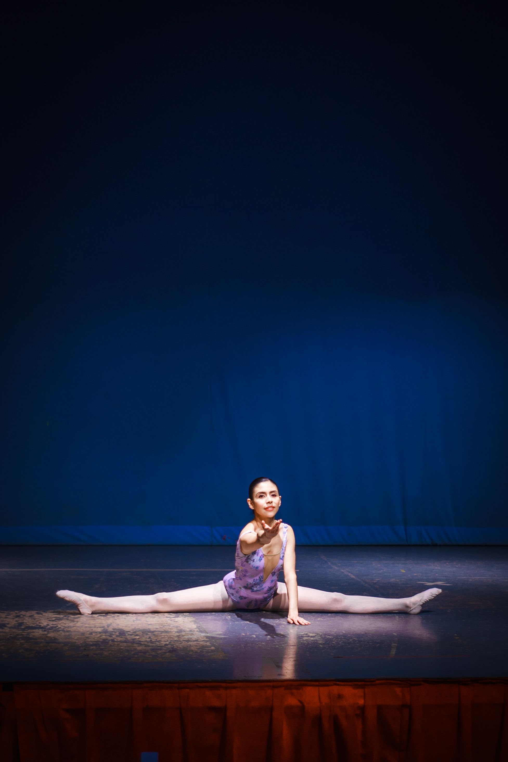 A Ballerina Doing the Splits on Stage · Free Stock Photo