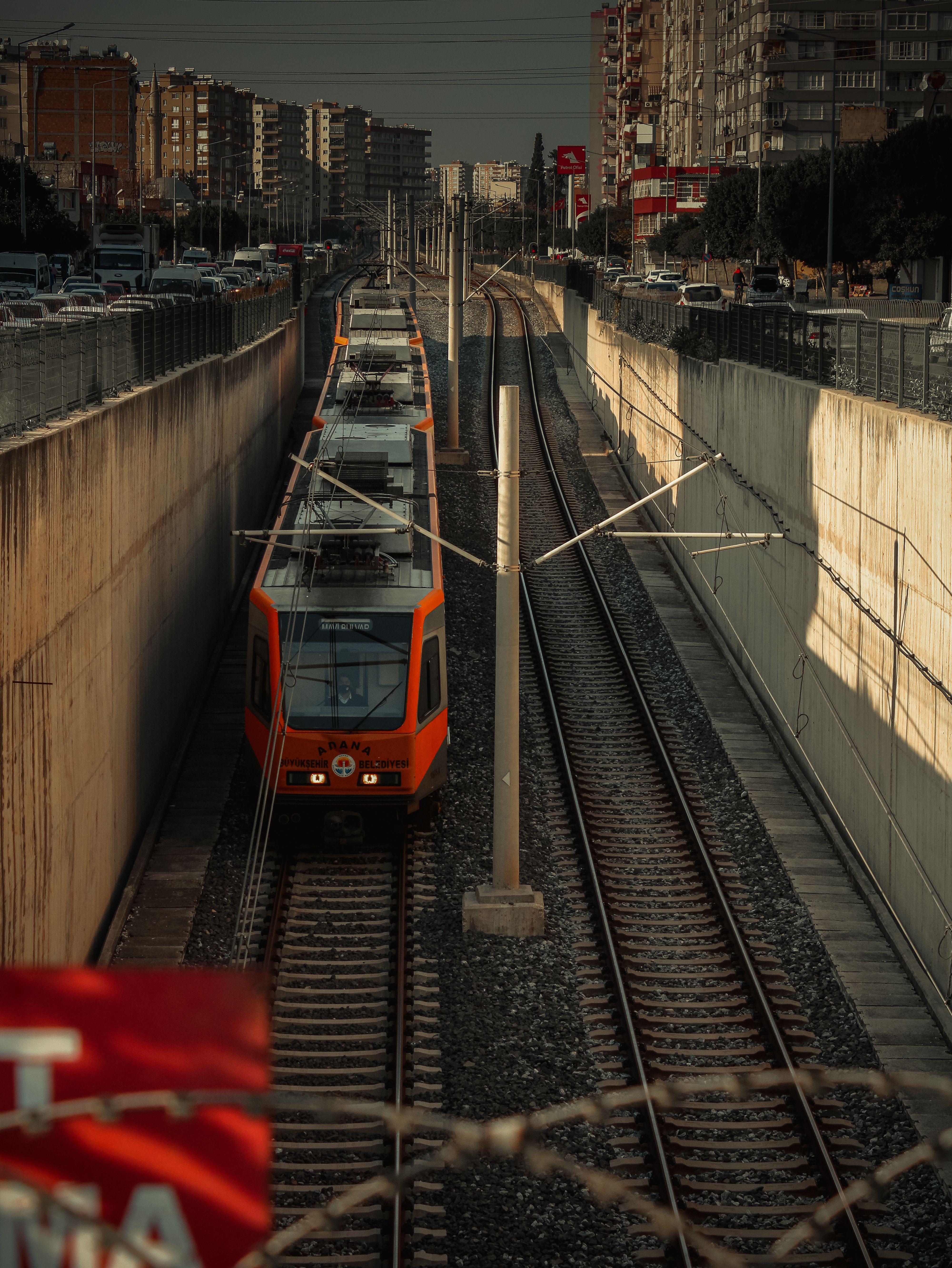 Trains Riding on Railroad Tracks in City · Free Stock Photo