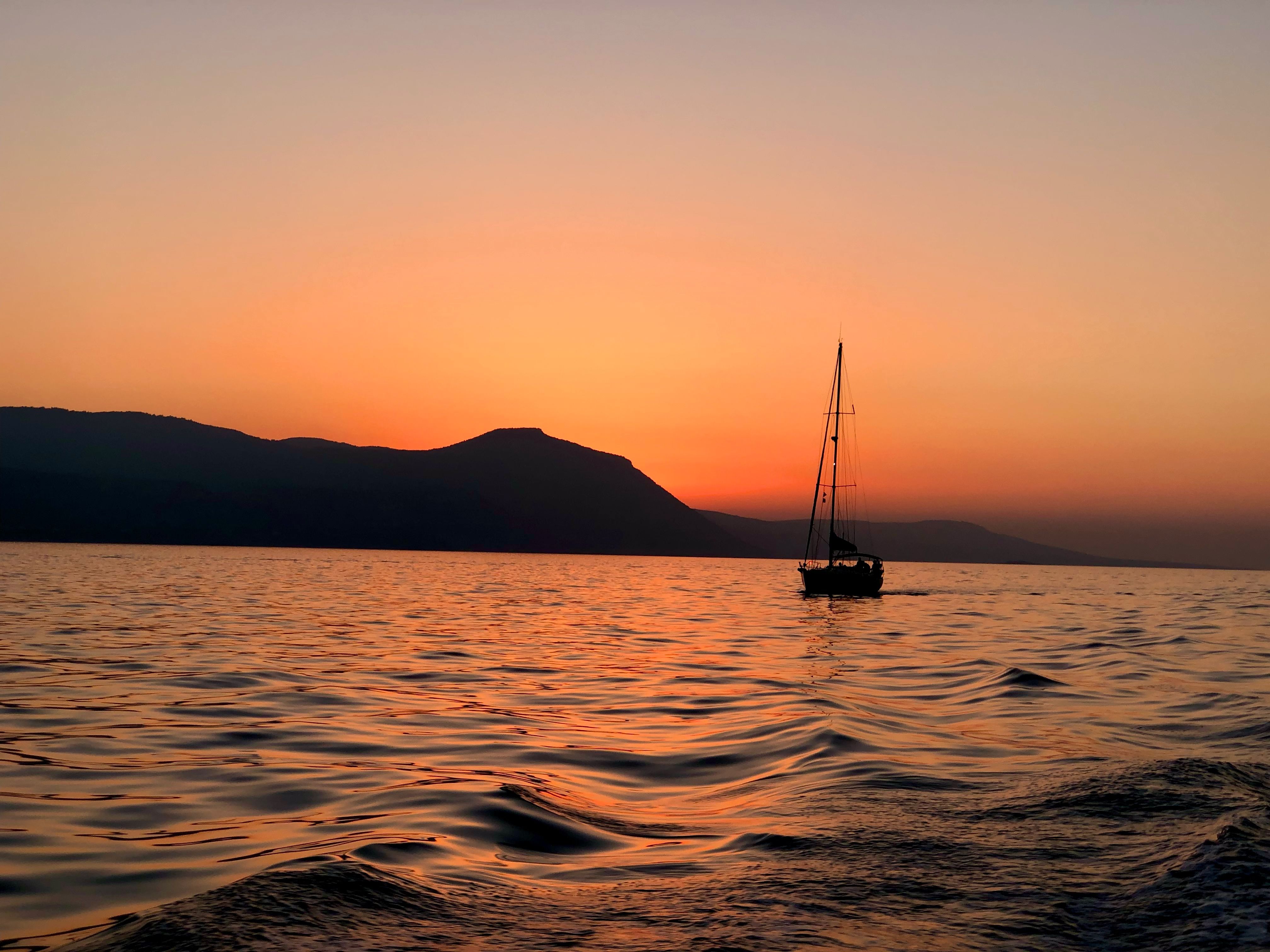 Sailboat on Coast at sunset · Free Stock Photo