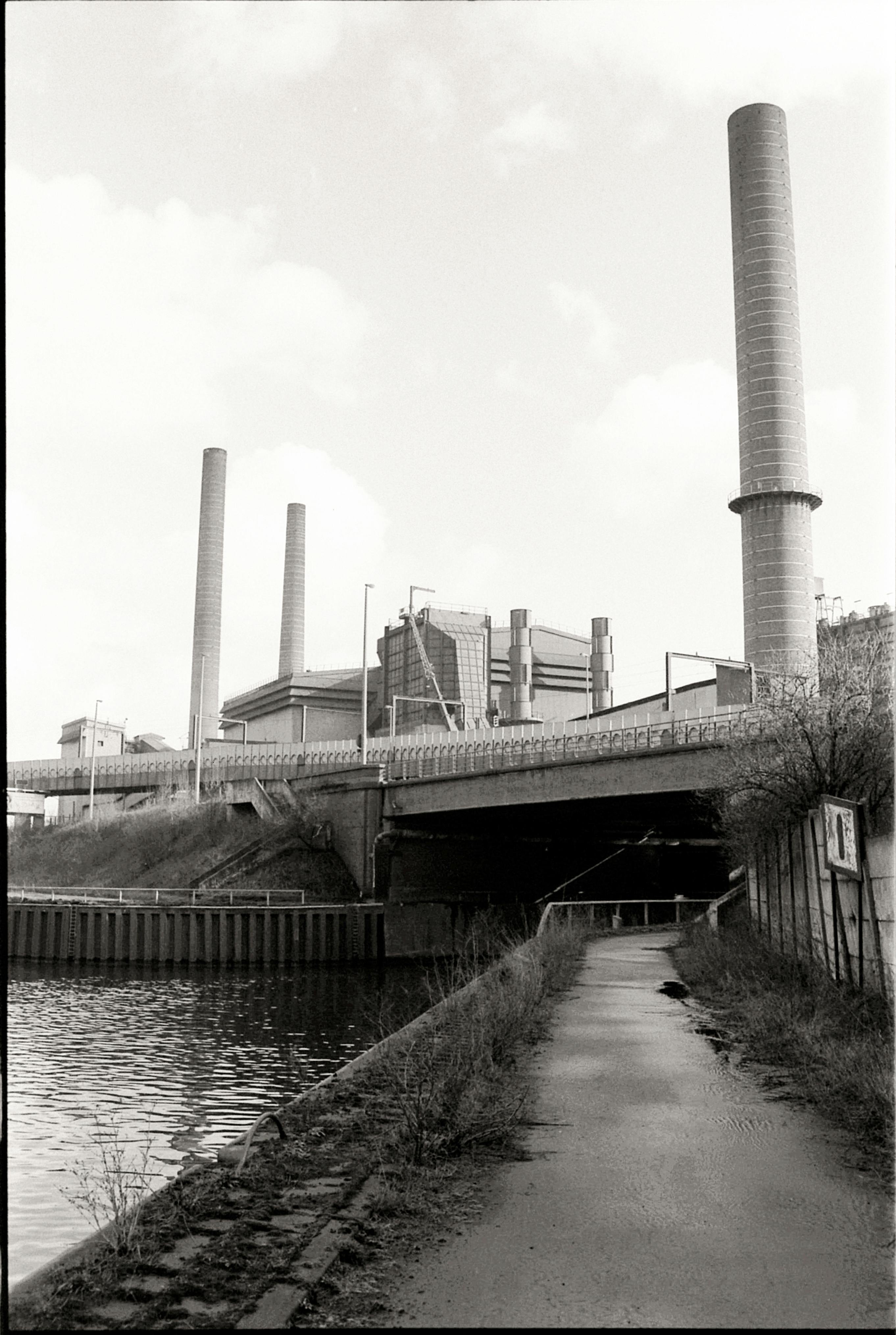 Factory by the River in Black and White · Free Stock Photo