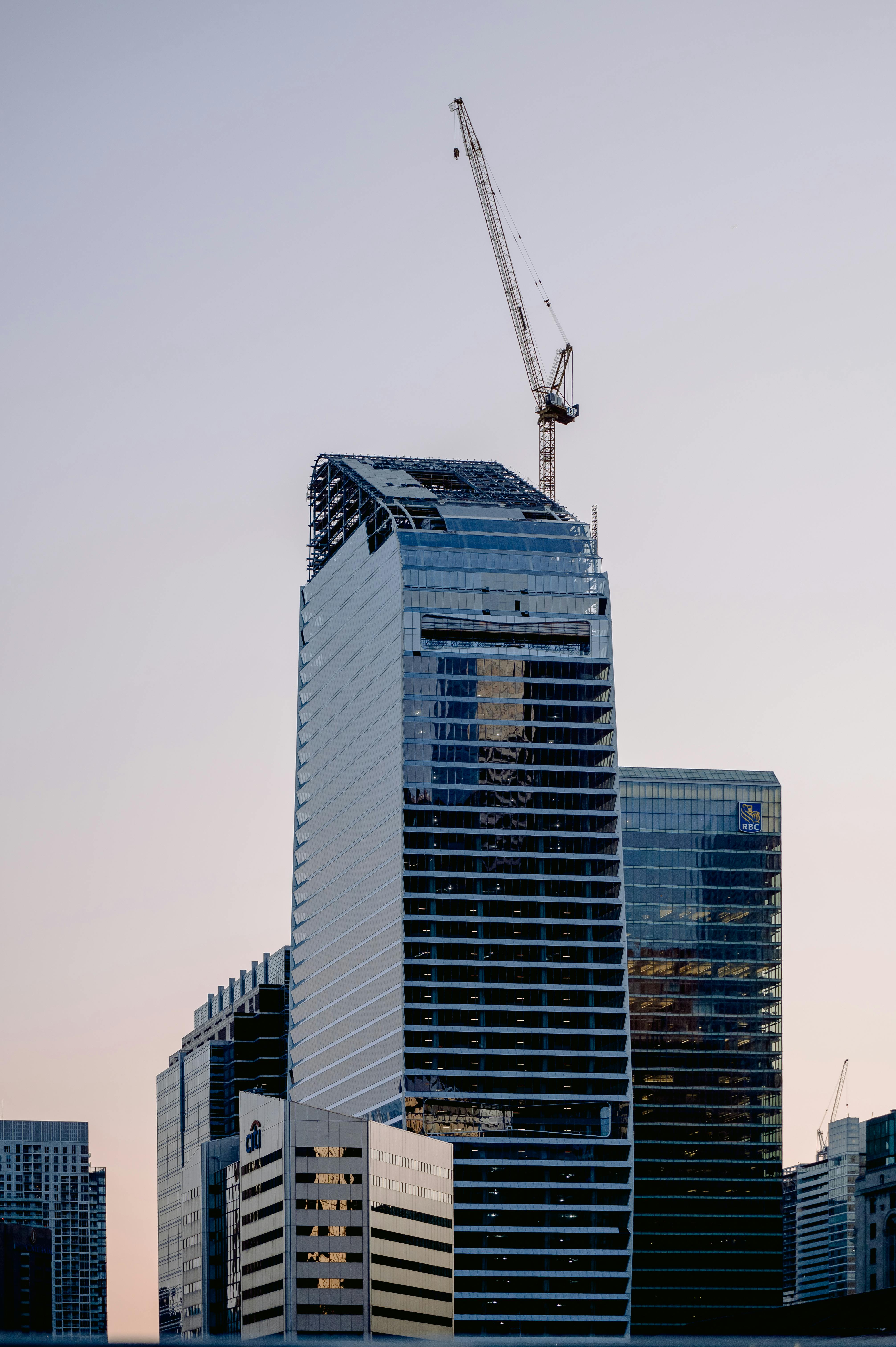 Shot of Wharf Cranes and Skyscrapers · Free Stock Photo