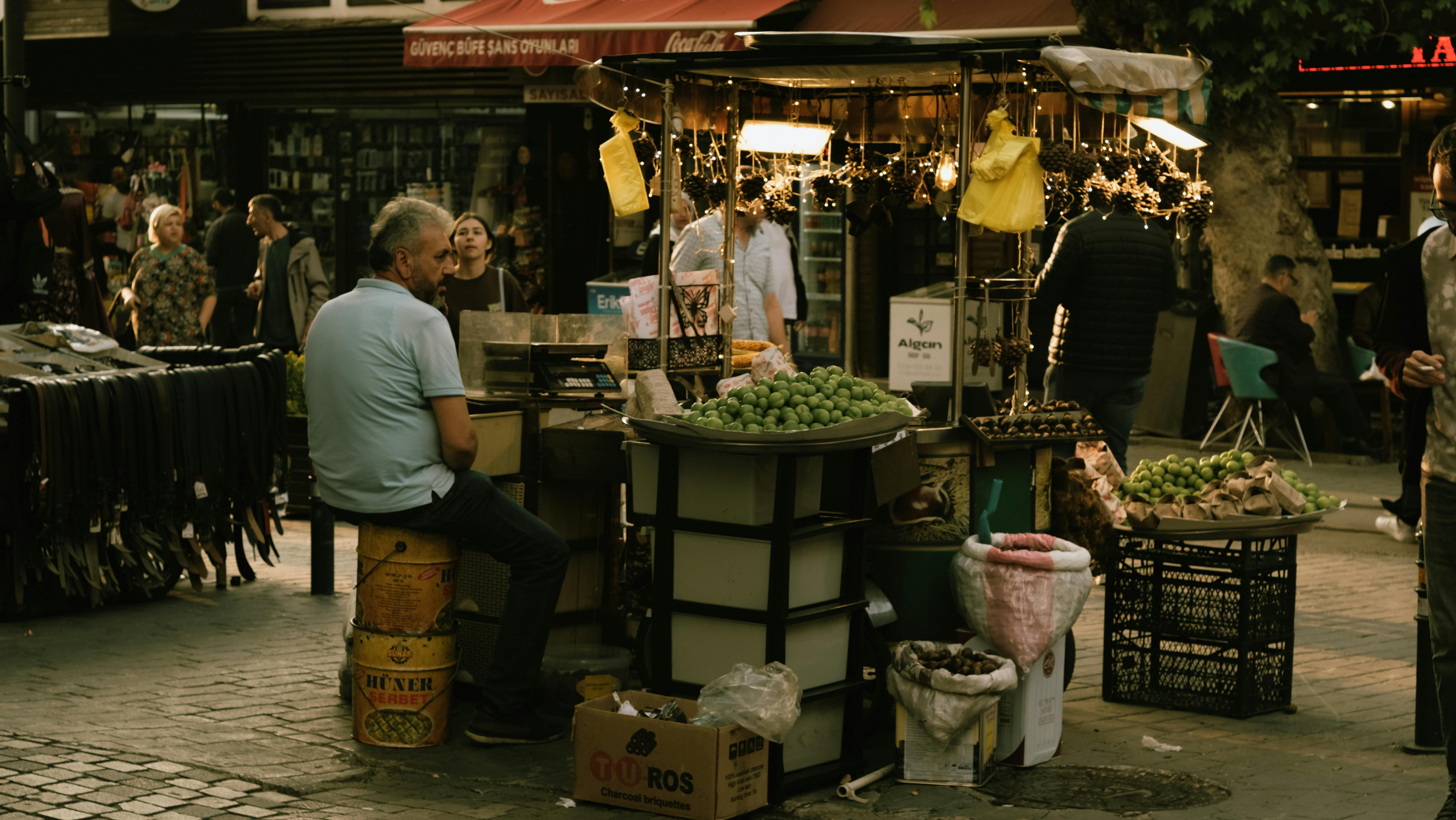 Man Standing by Market Stalls Full of Paper Lanterns · Free Stock Photo