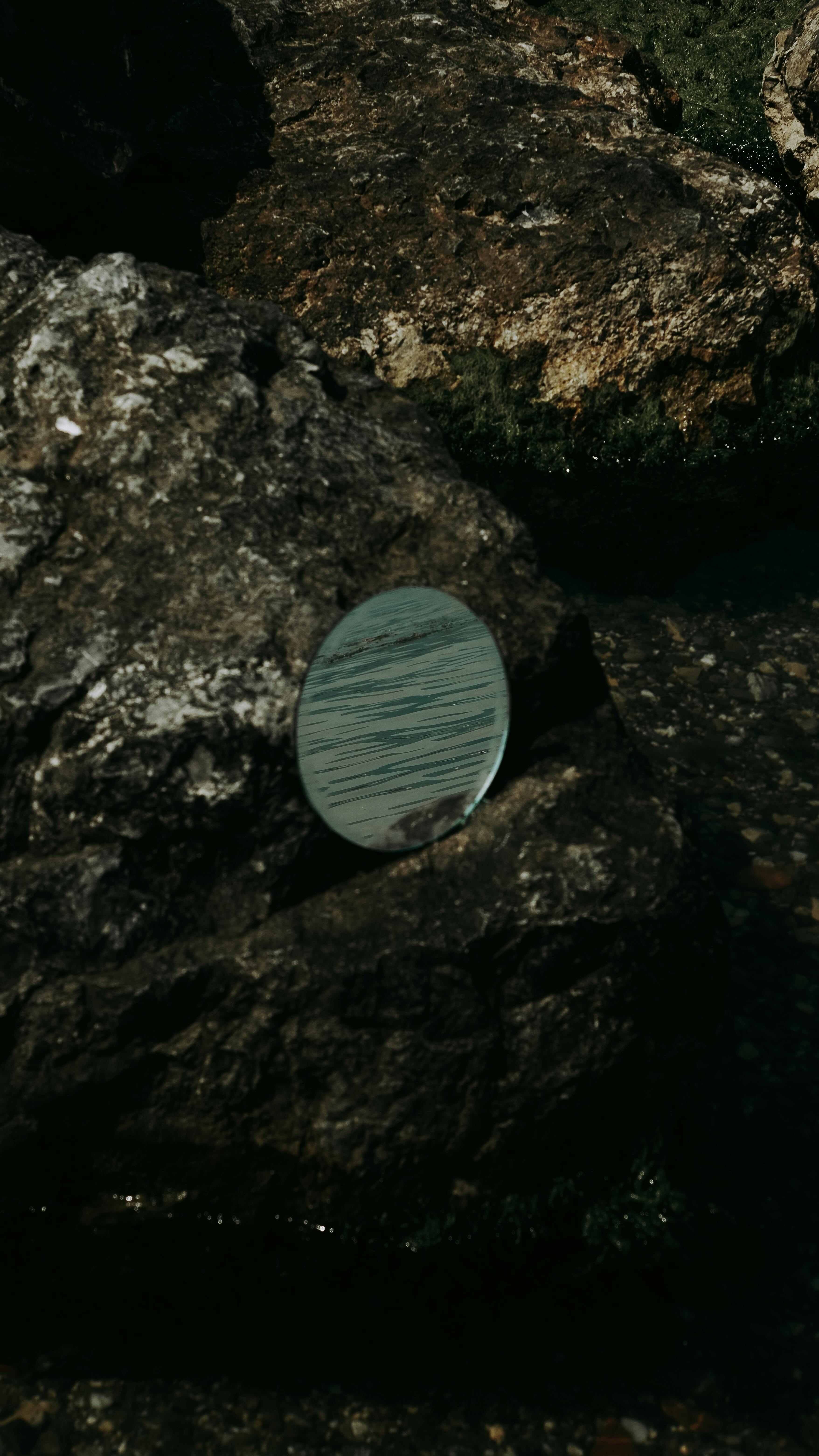 Sea Reflecting in Round Mirror · Free Stock Photo