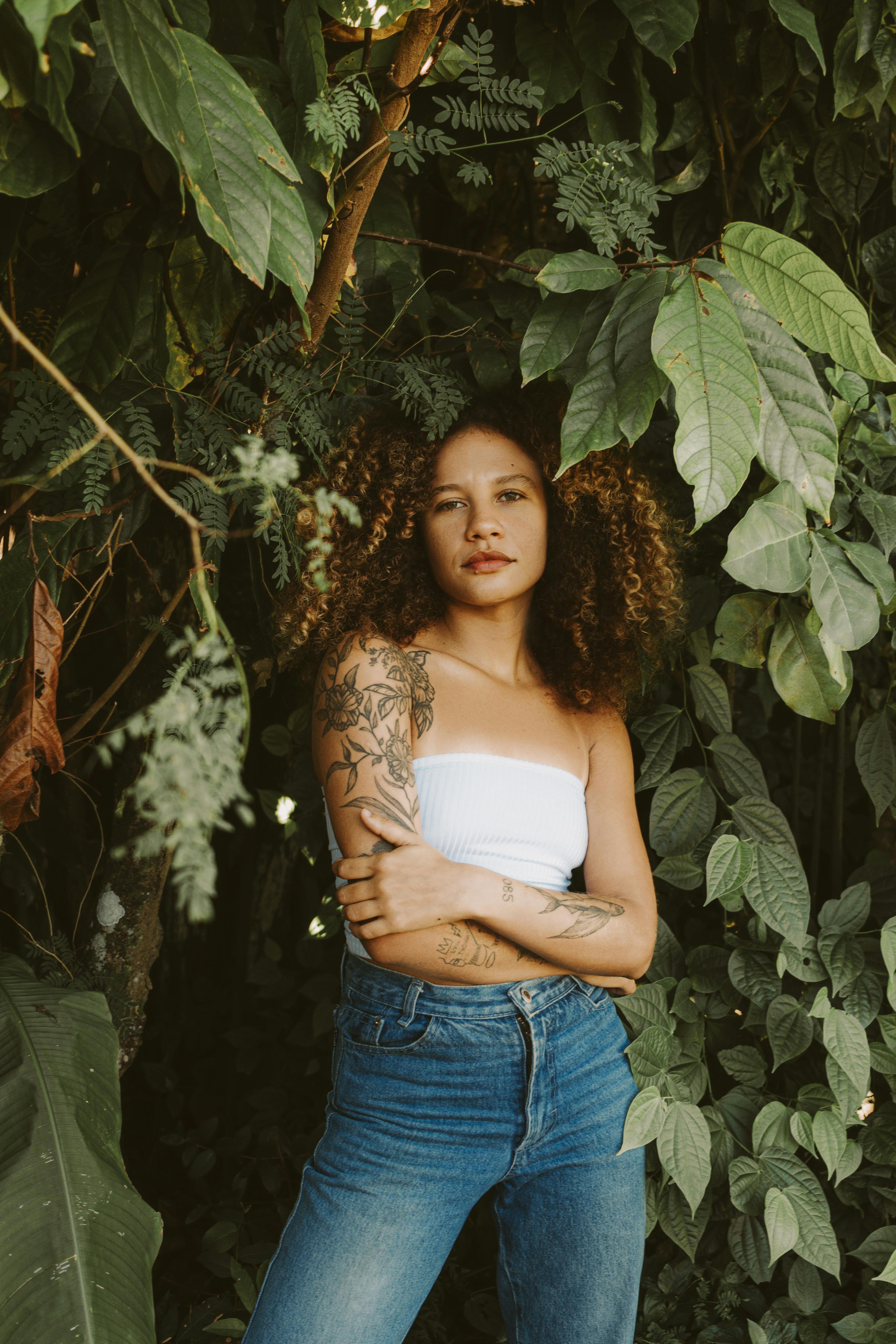 Young Woman with Tattoos Posing Outdoors in Summer · Free Stock Photo