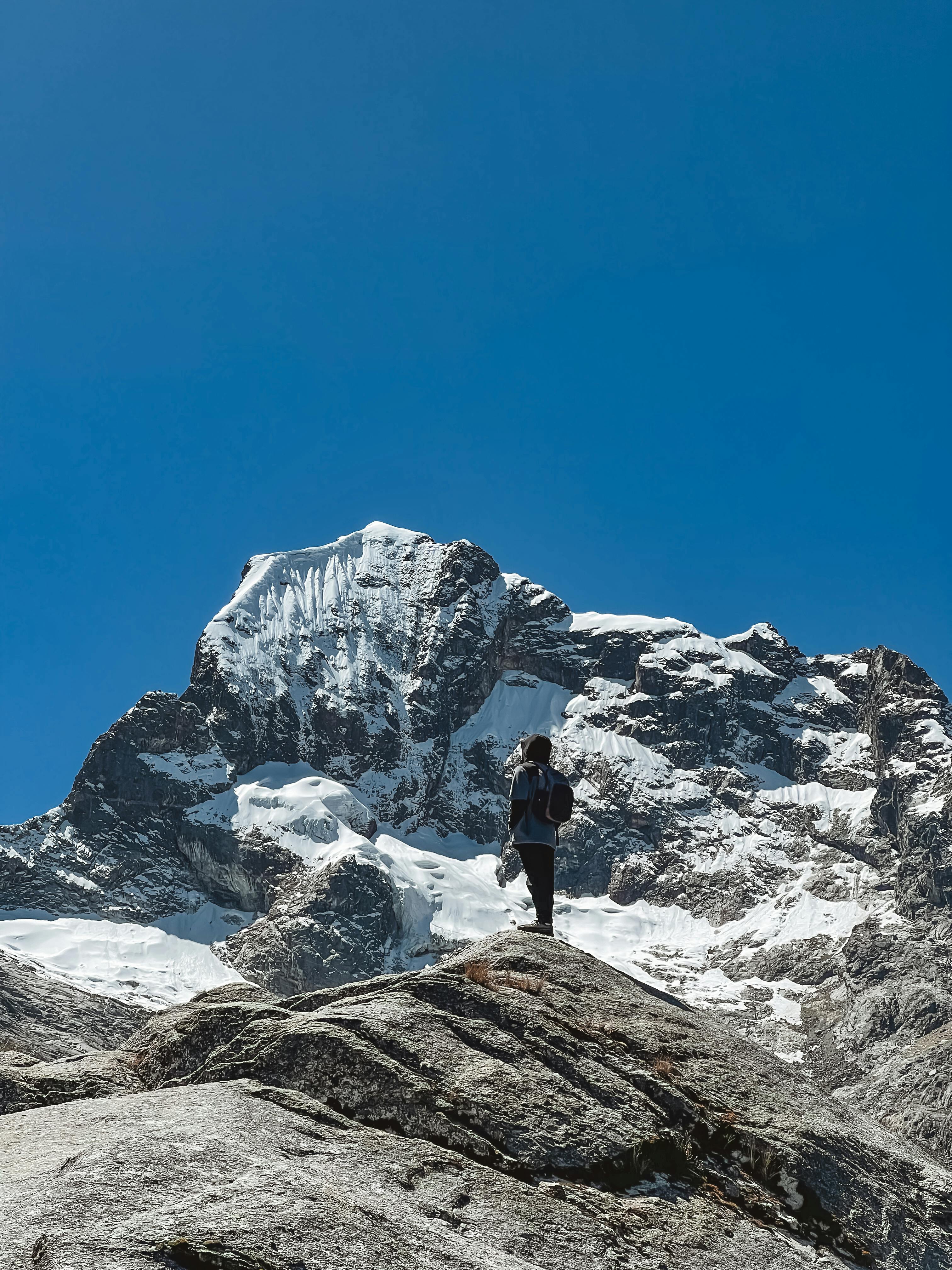 Person in an Alien Costume Standing on a Rocky Surface · Free Stock Photo