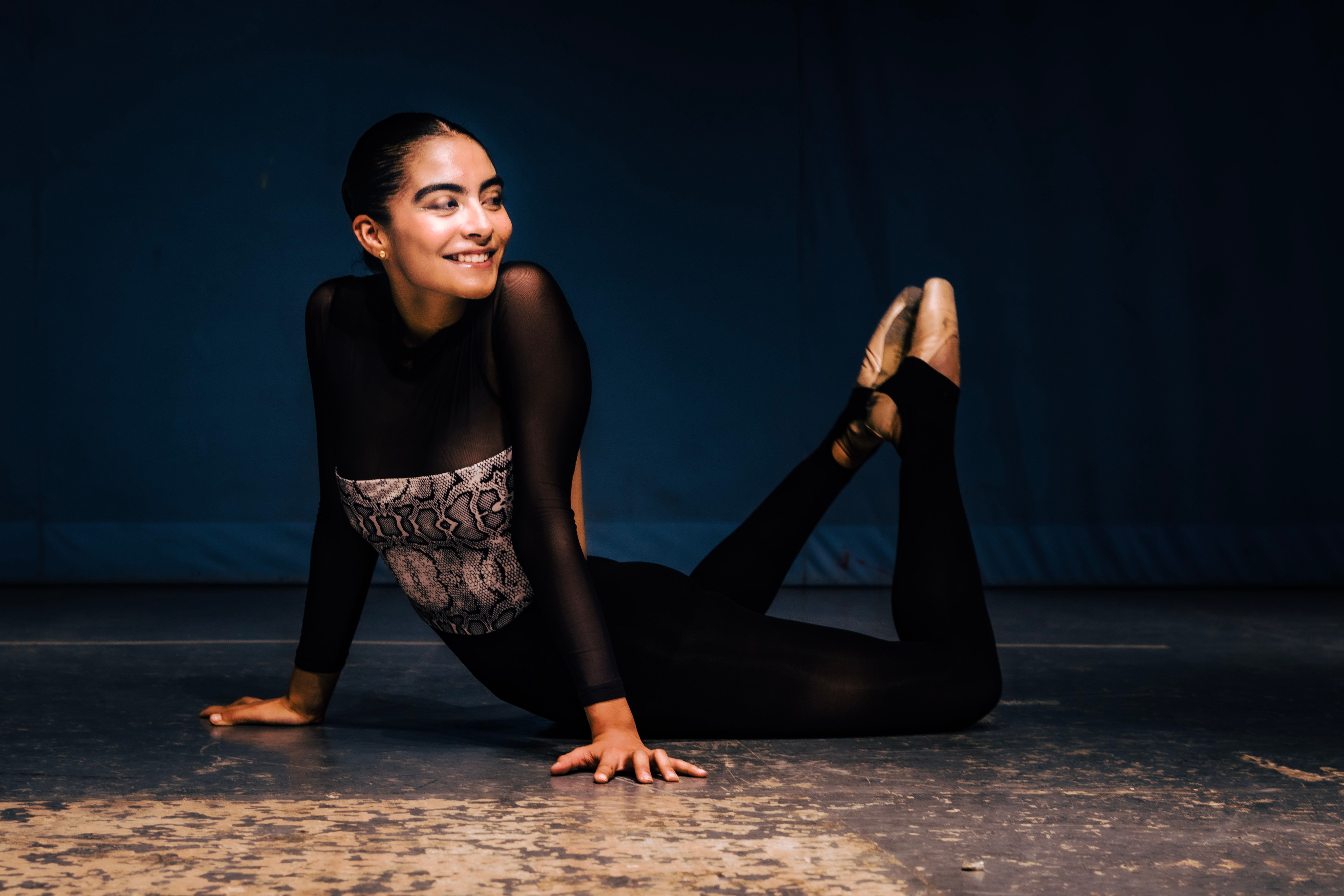 Ballerina Dancer Dancing on the Stage Floor · Free Stock Photo