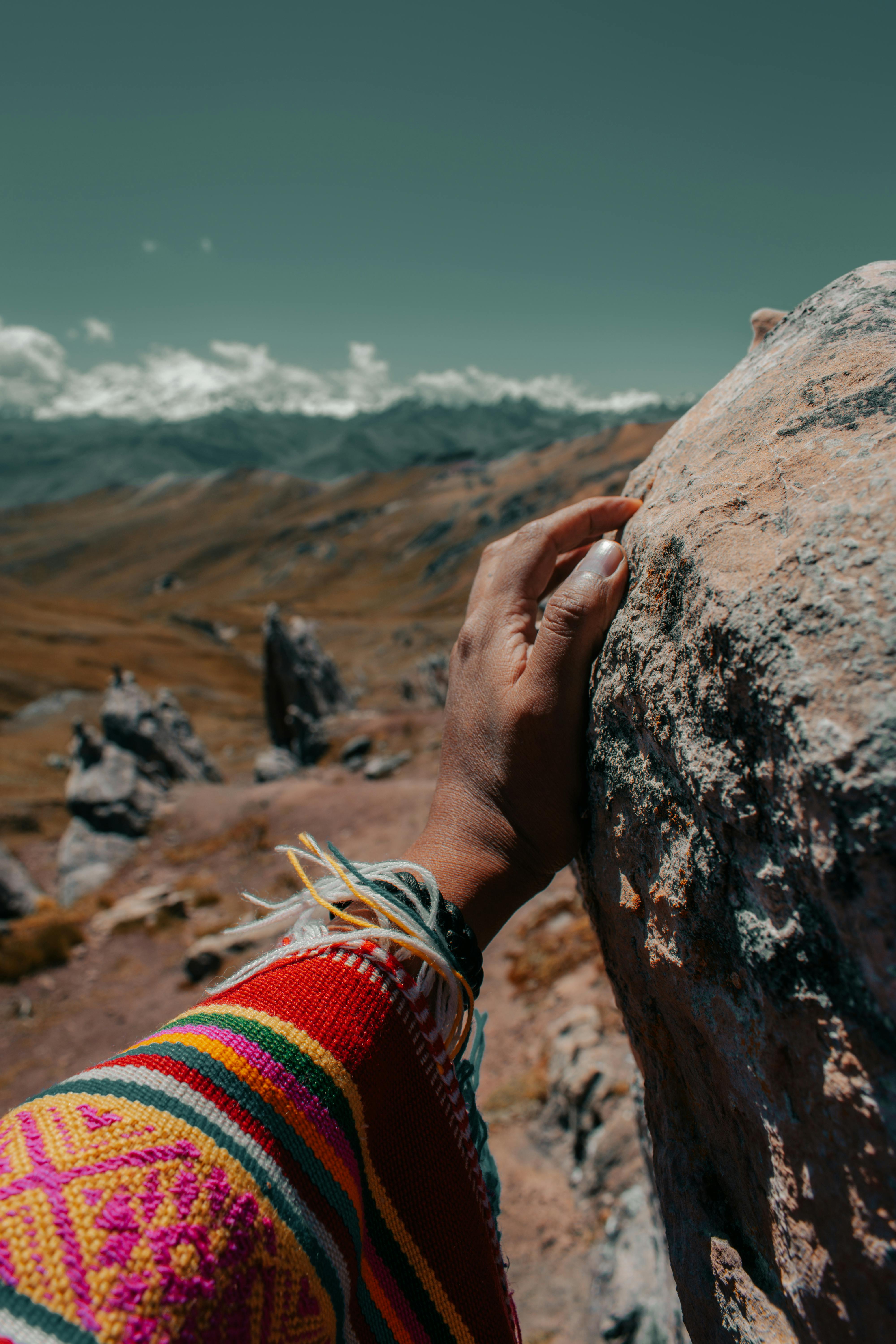Close-up of a Persons Hand Touching a Rock · Free Stock Photo