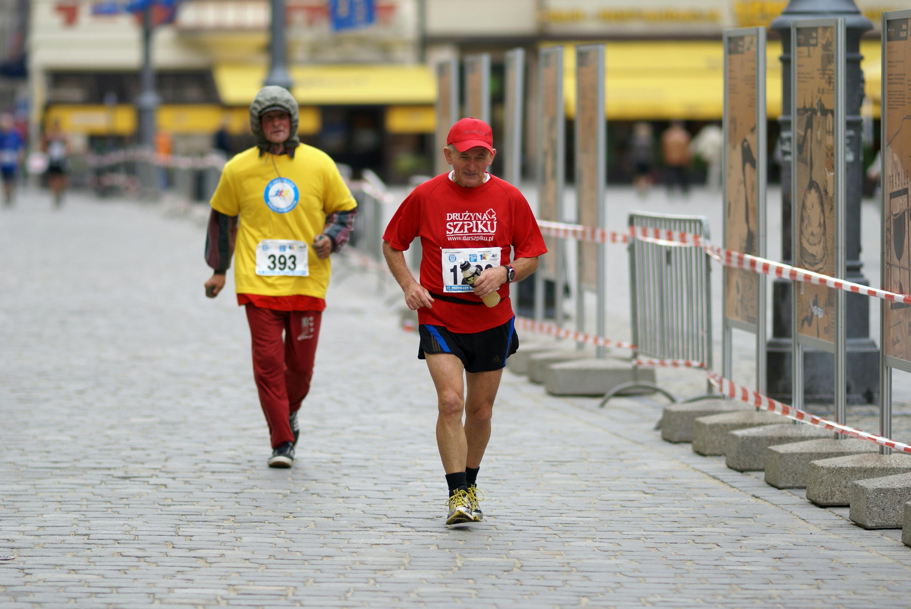 Two Men Running On Track · Free Stock Photo