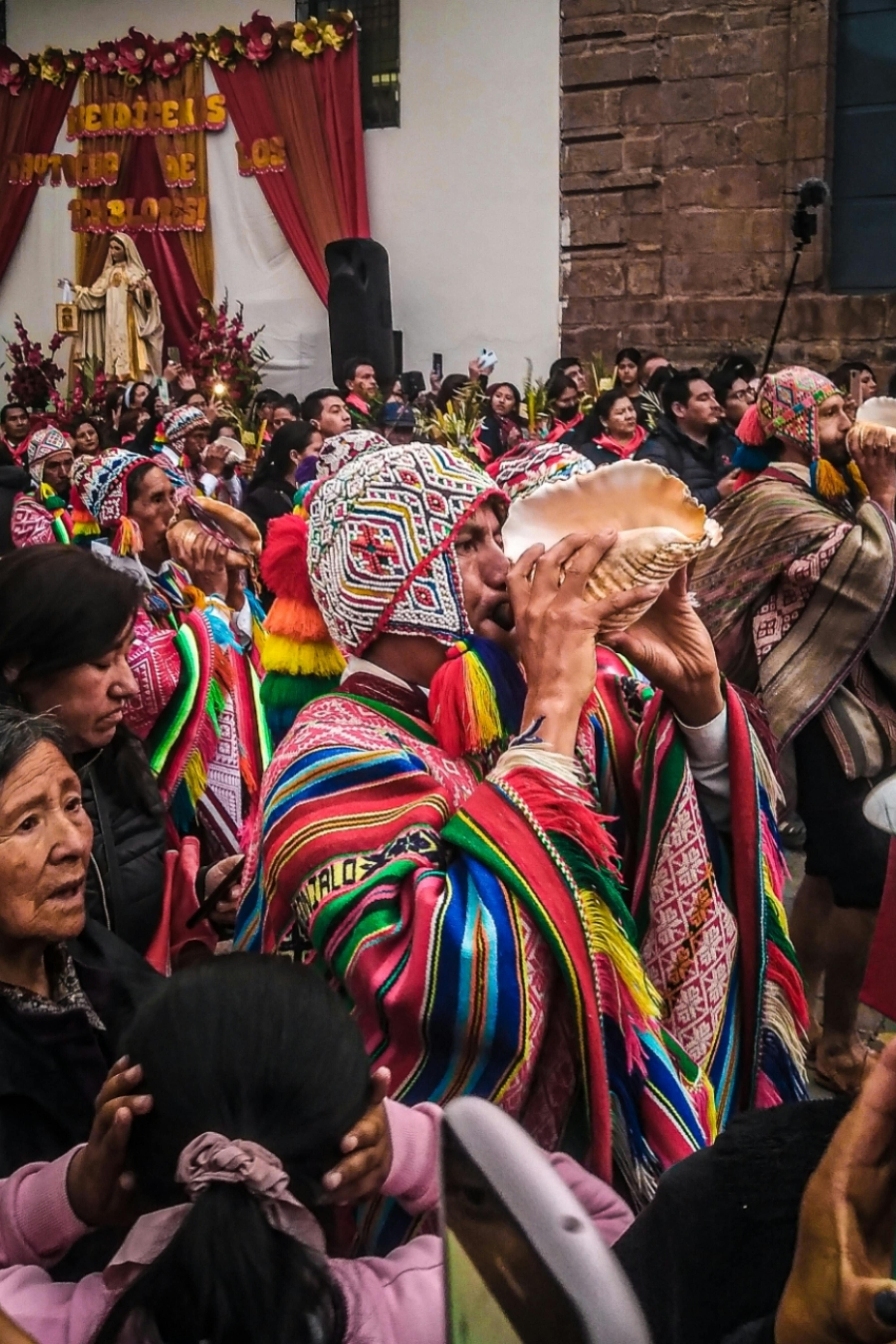 A Crowd in Traditional Peruvian Clothing at a Parade during a ...
