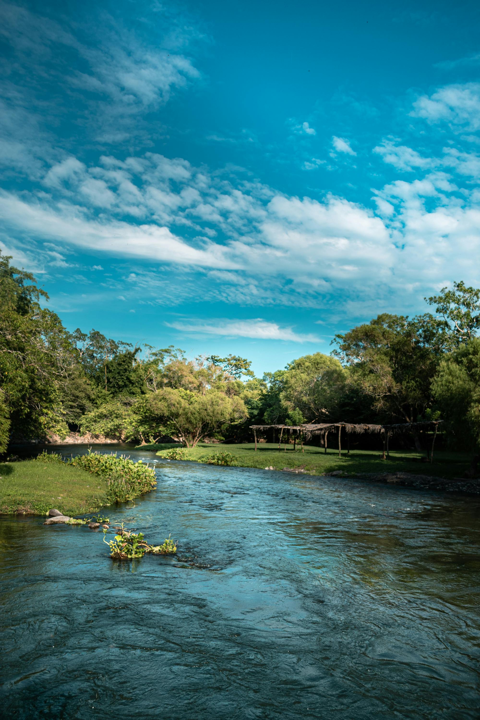 Roofed Campsite by River · Free Stock Photo