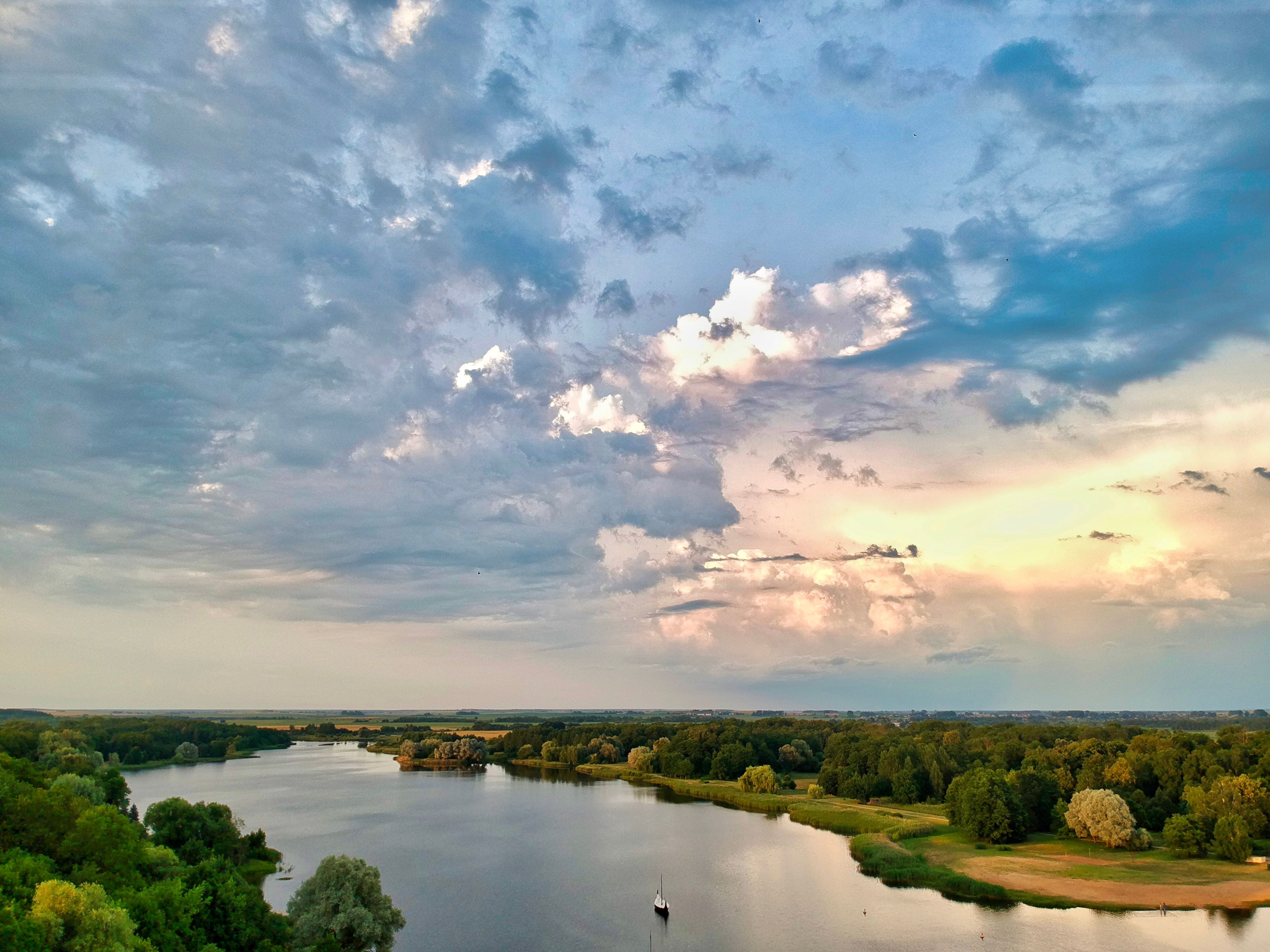 Clouds over River and Forest on Plains · Free Stock Photo