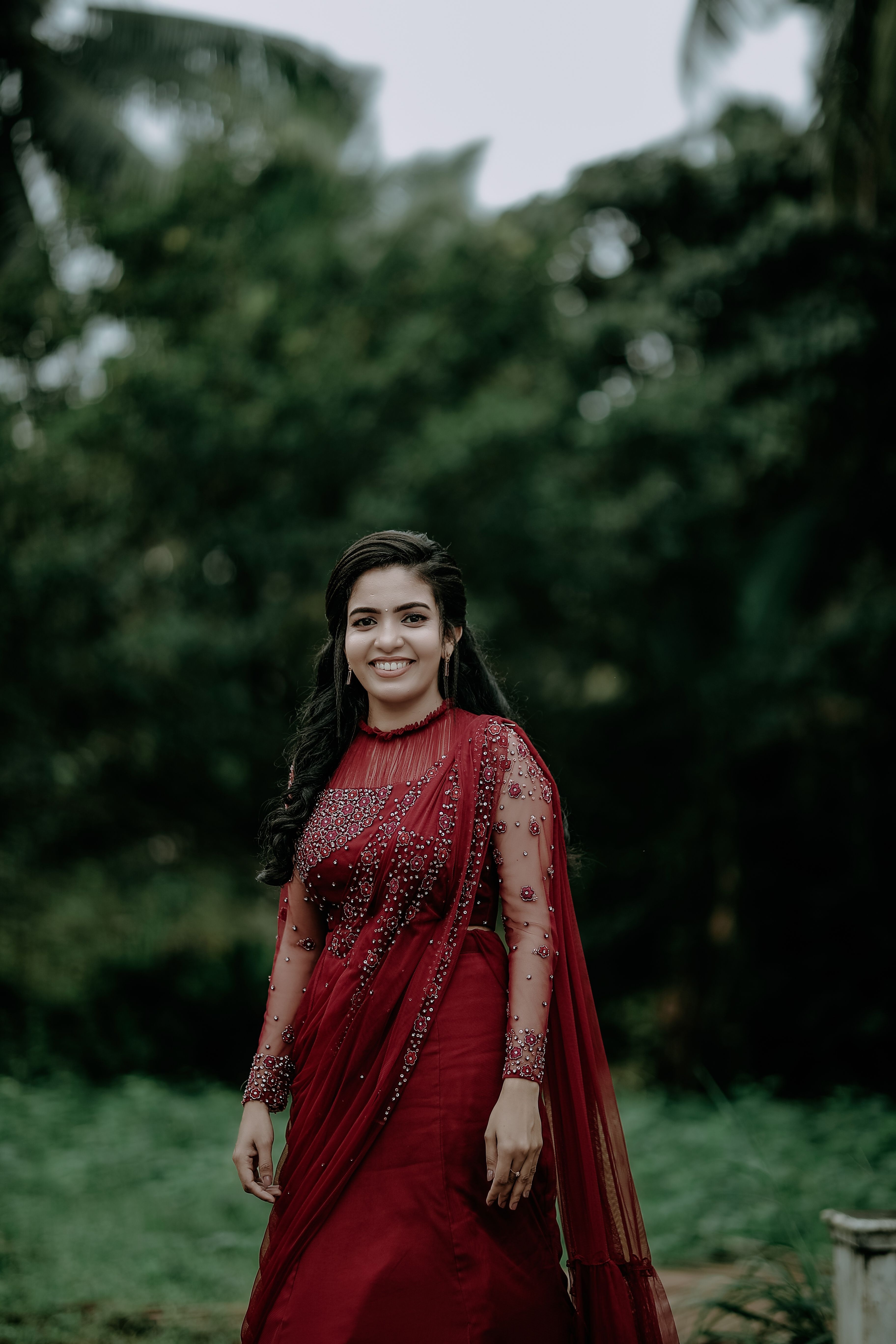 Portrait of a Woman Standing in a Dress · Free Stock Photo