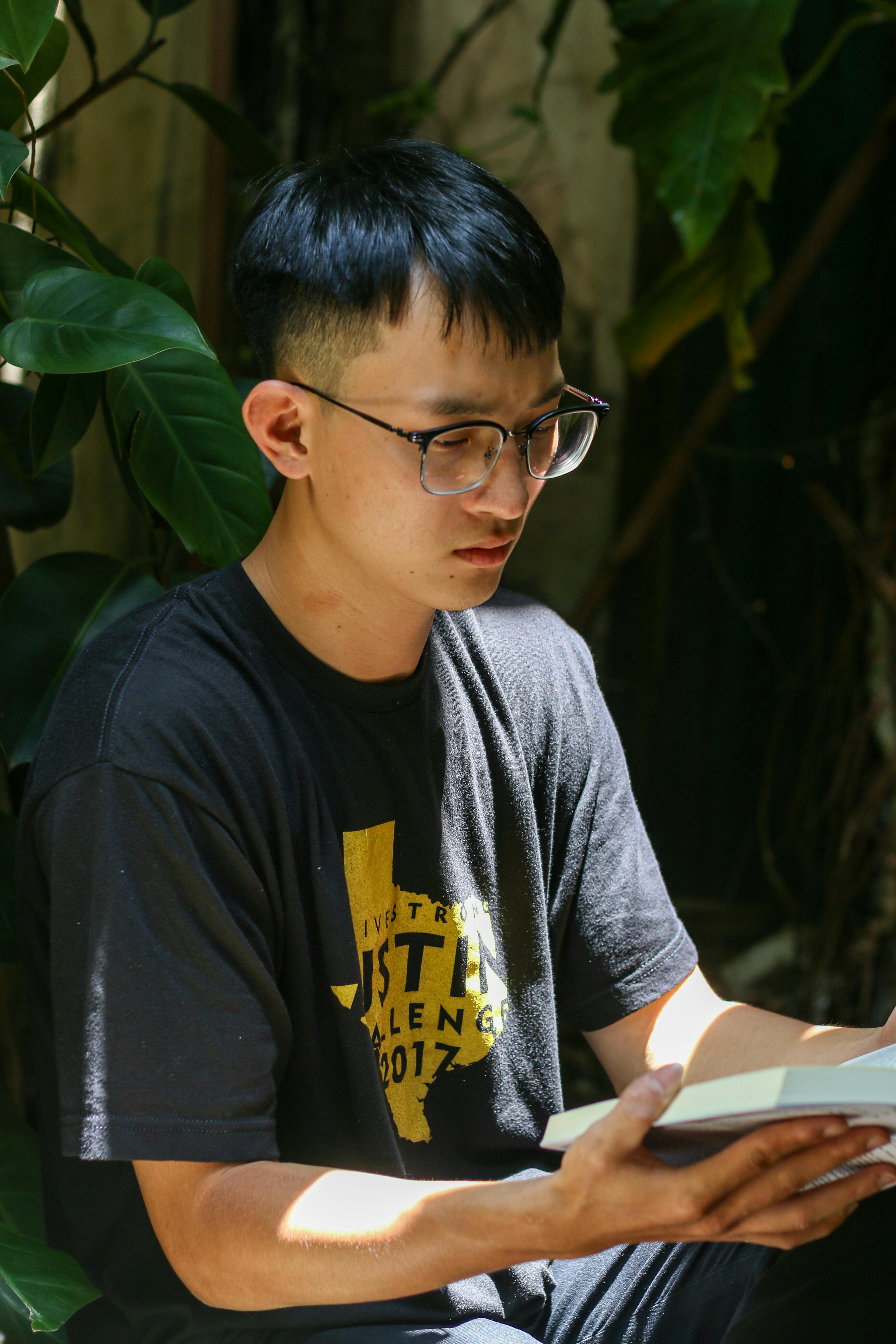 Man Posing with Books · Free Stock Photo