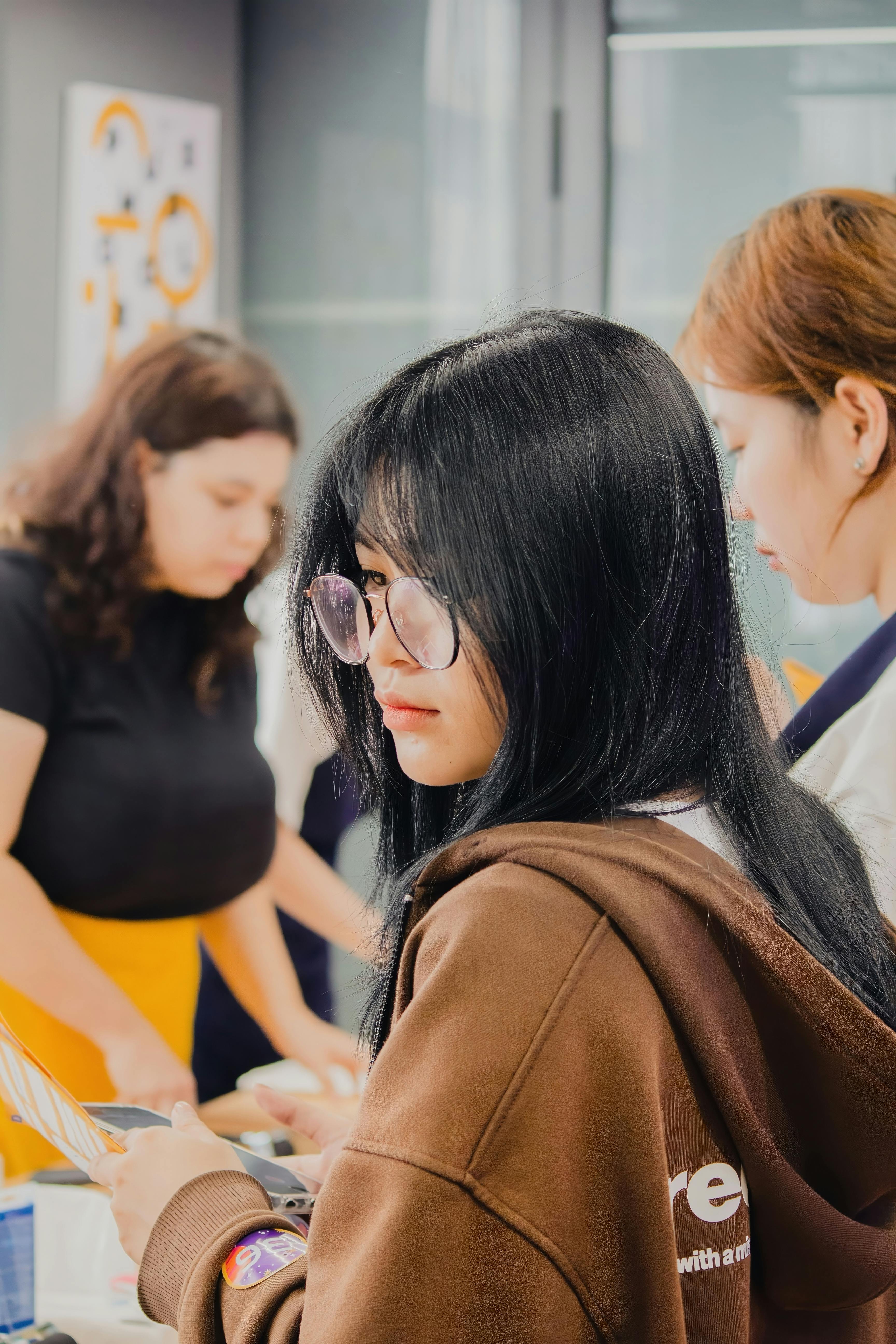 A Young Woman Biting Her Index Finger with a Shut Up Note · Free Stock ...