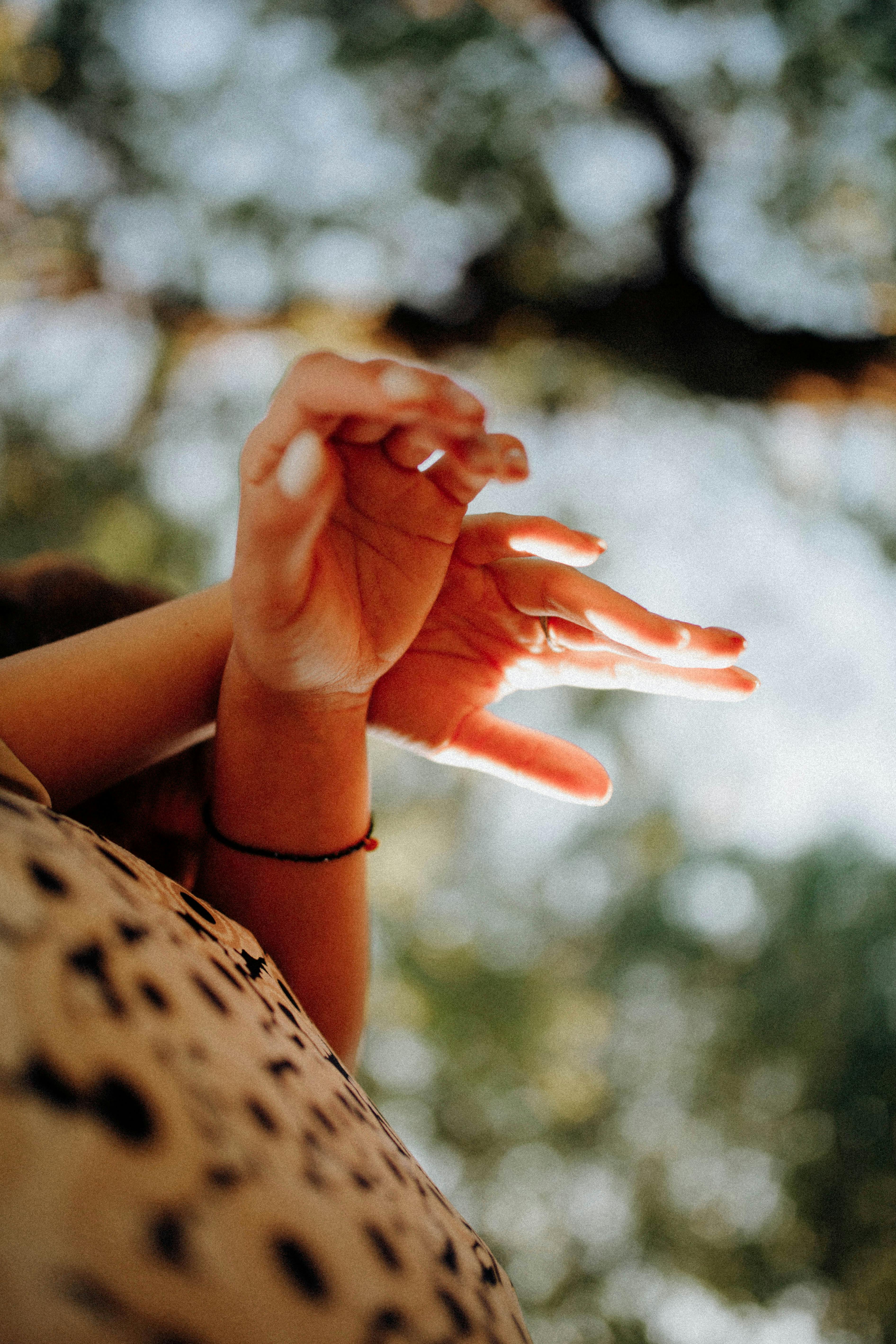 Raised female hand against wall · Free Stock Photo