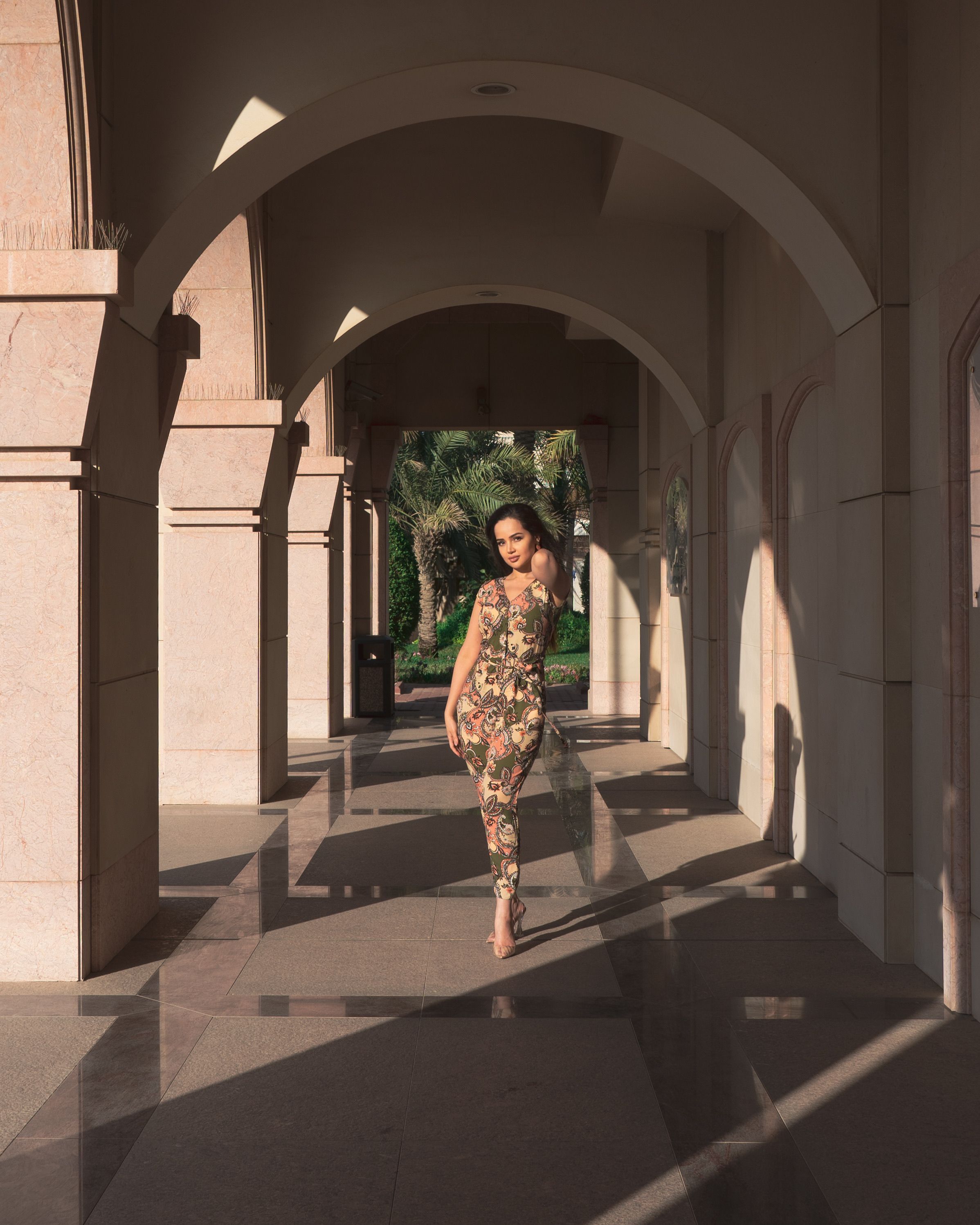Woman in Dress Standing under Building Arches · Free Stock Photo