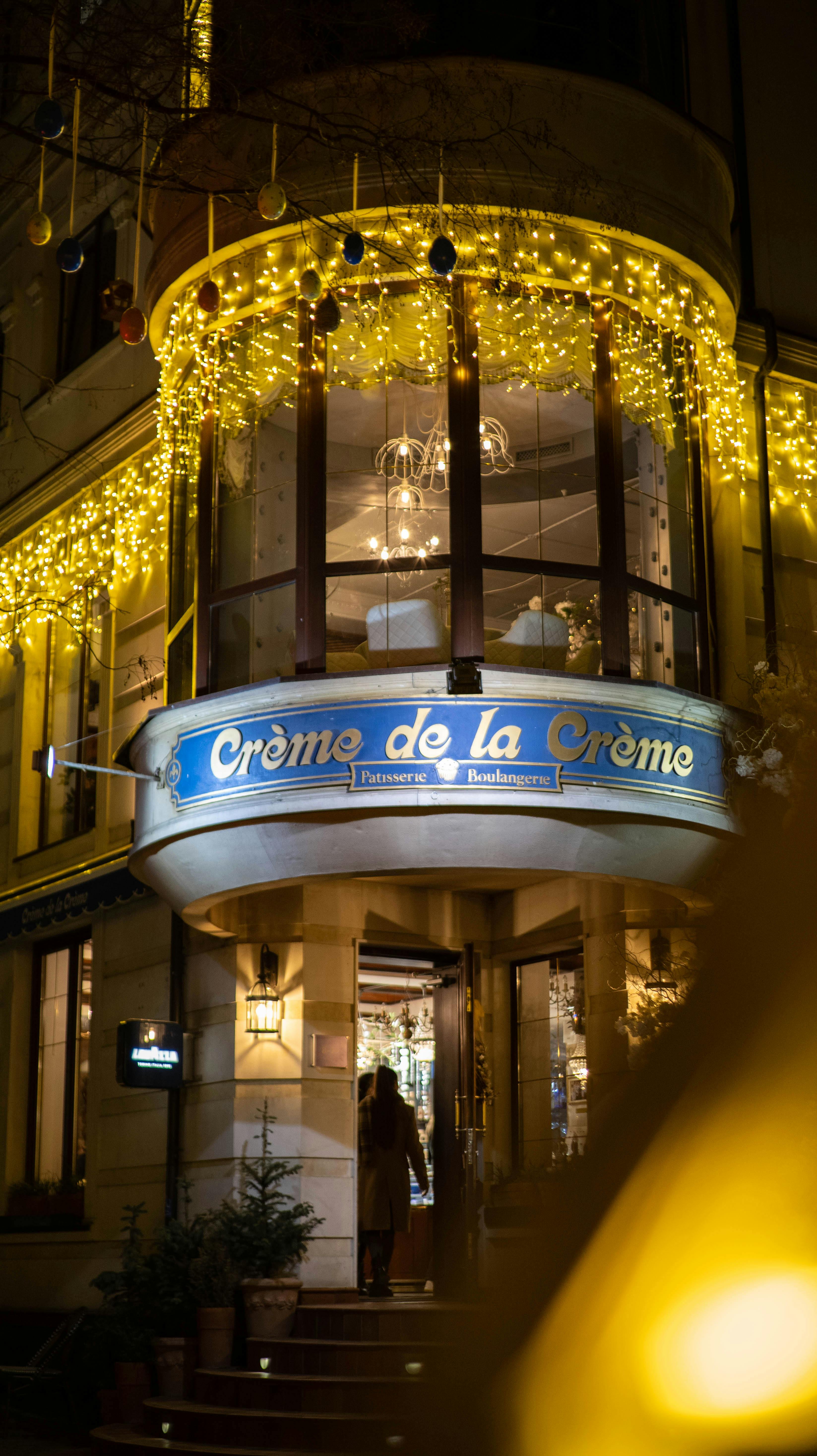View of Illuminated Exterior of the Creme de la Creme Restaurant in ...