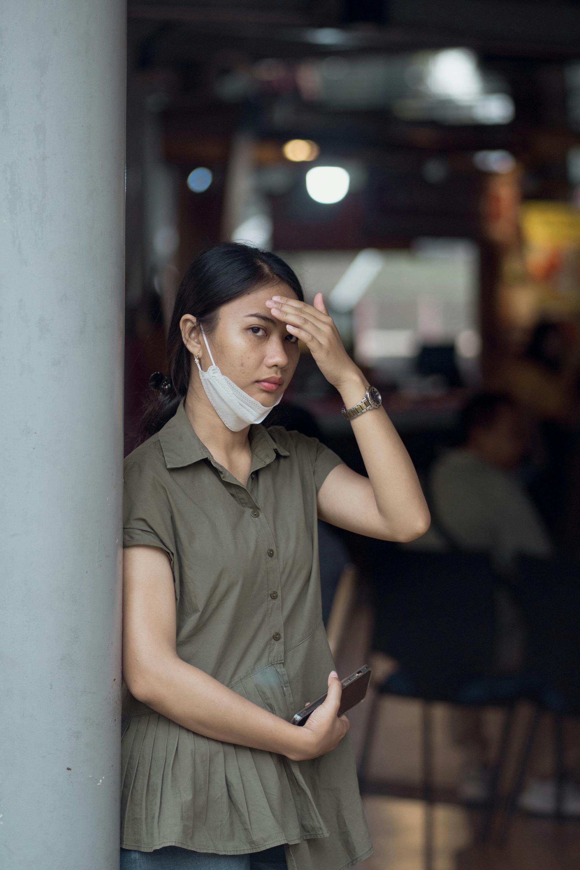 Woman in Shirt Posing by Wall · Free Stock Photo