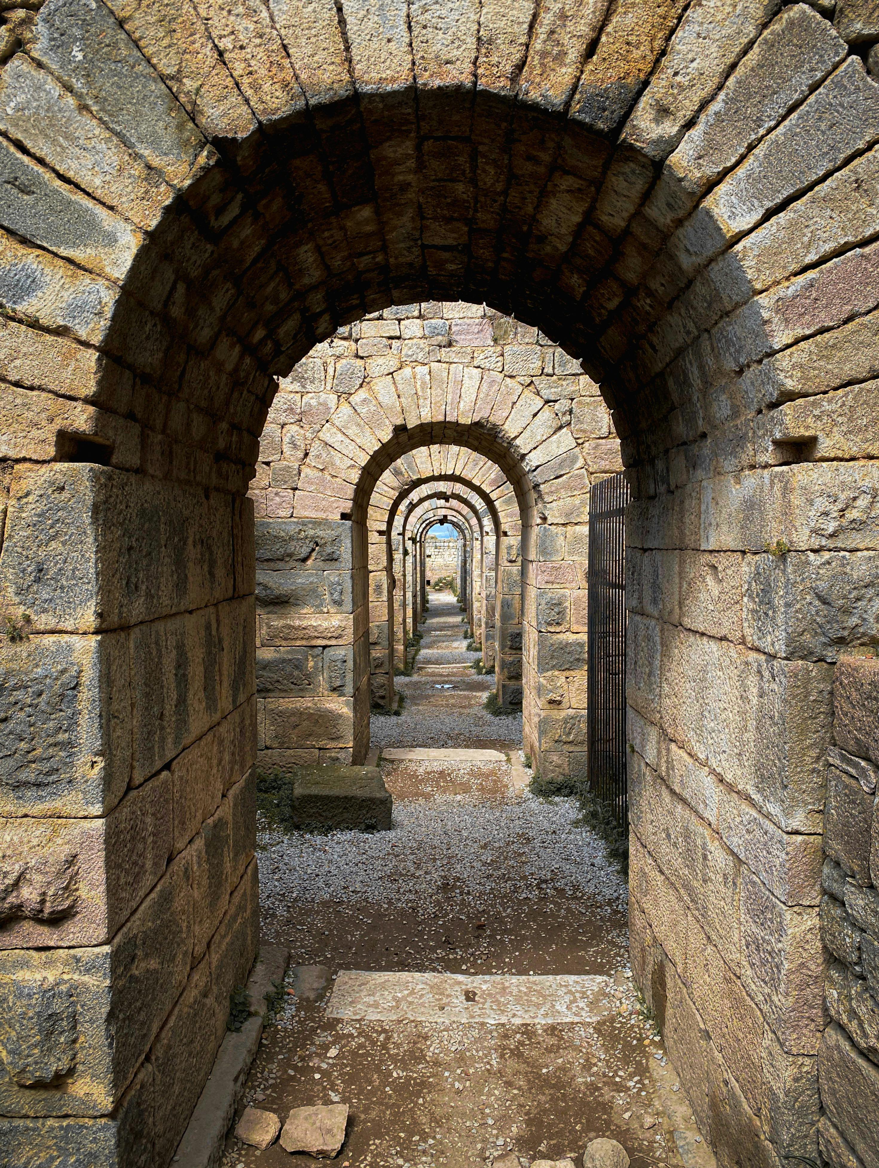 The arches of the old stone building are lined with stone · Free Stock ...