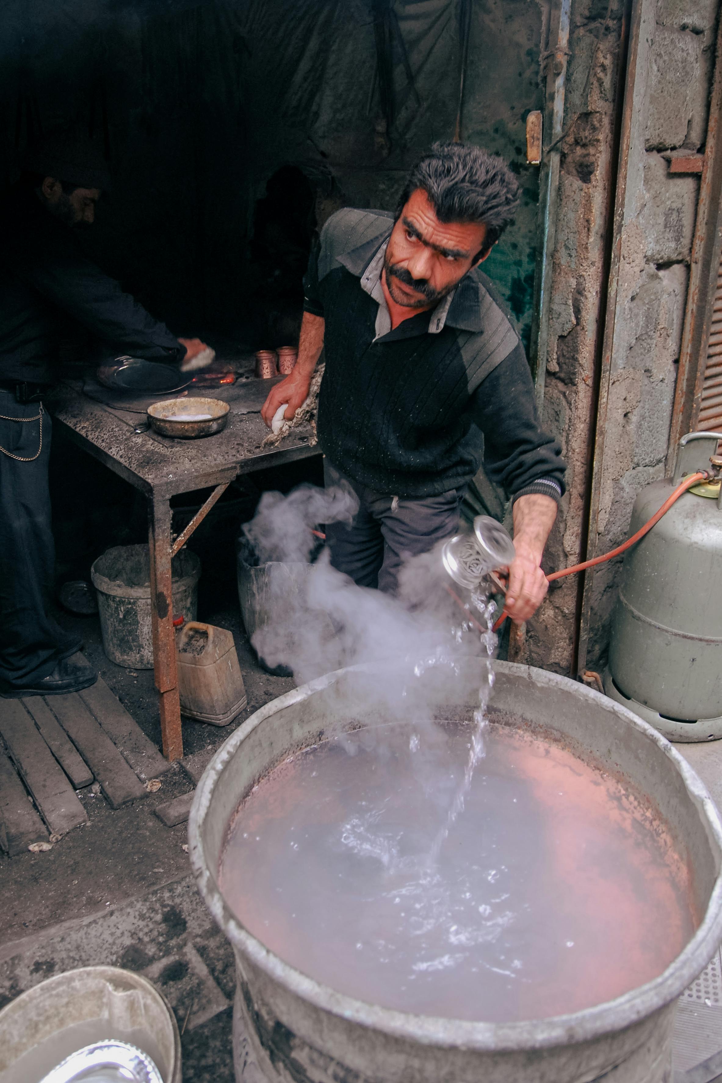 Man near Cauldron with Water · Free Stock Photo