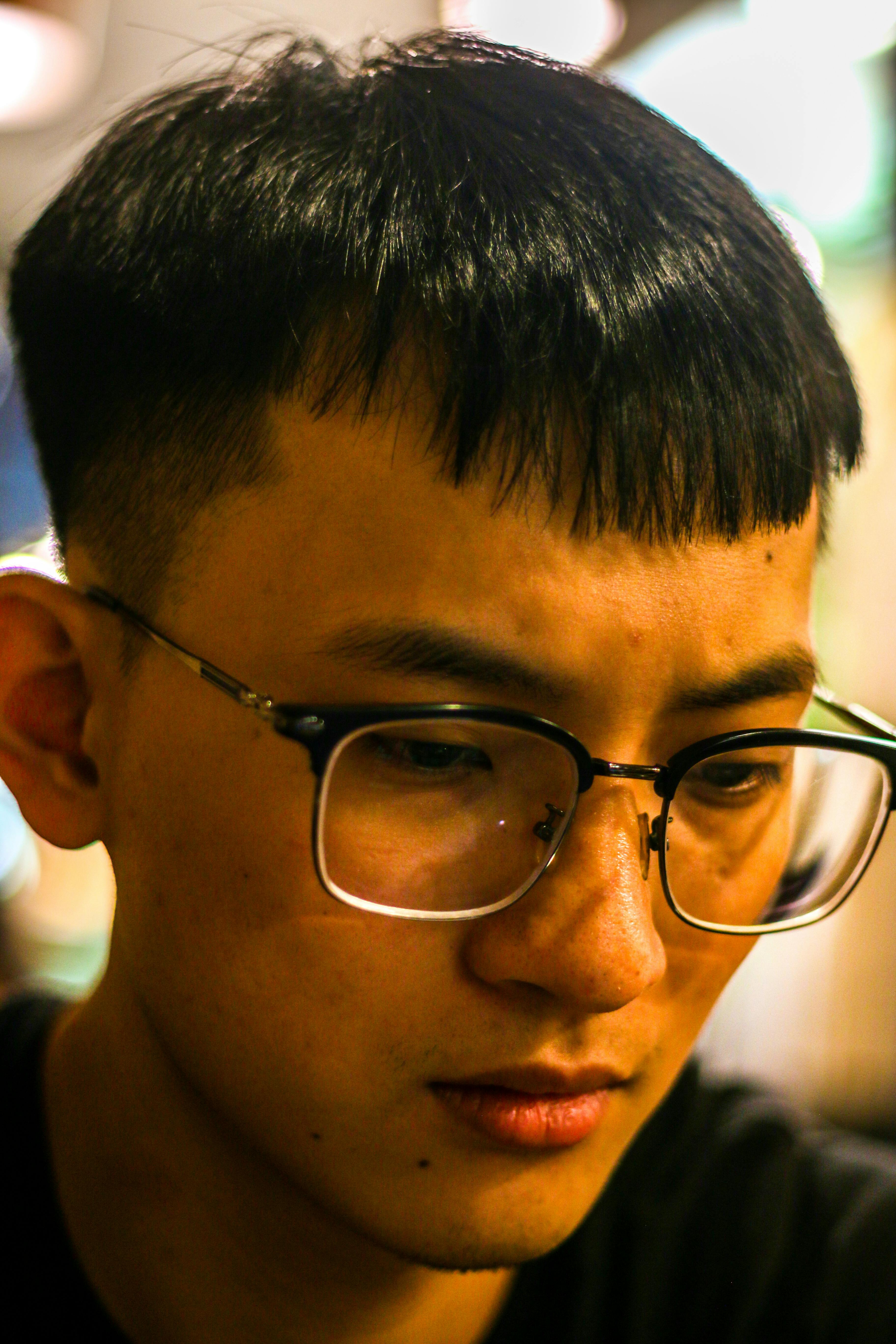 Young Man with a Concentrated Facial Expression · Free Stock Photo