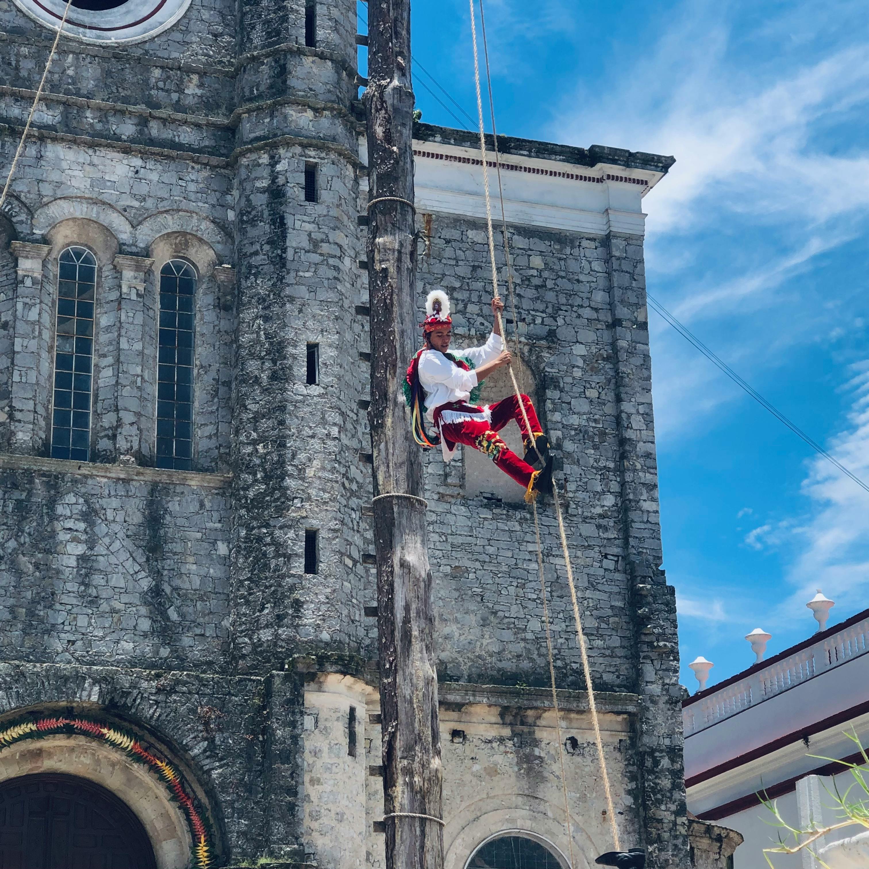 Traditional Mexican Performer Climbing a Rope near Old Church · Free ...