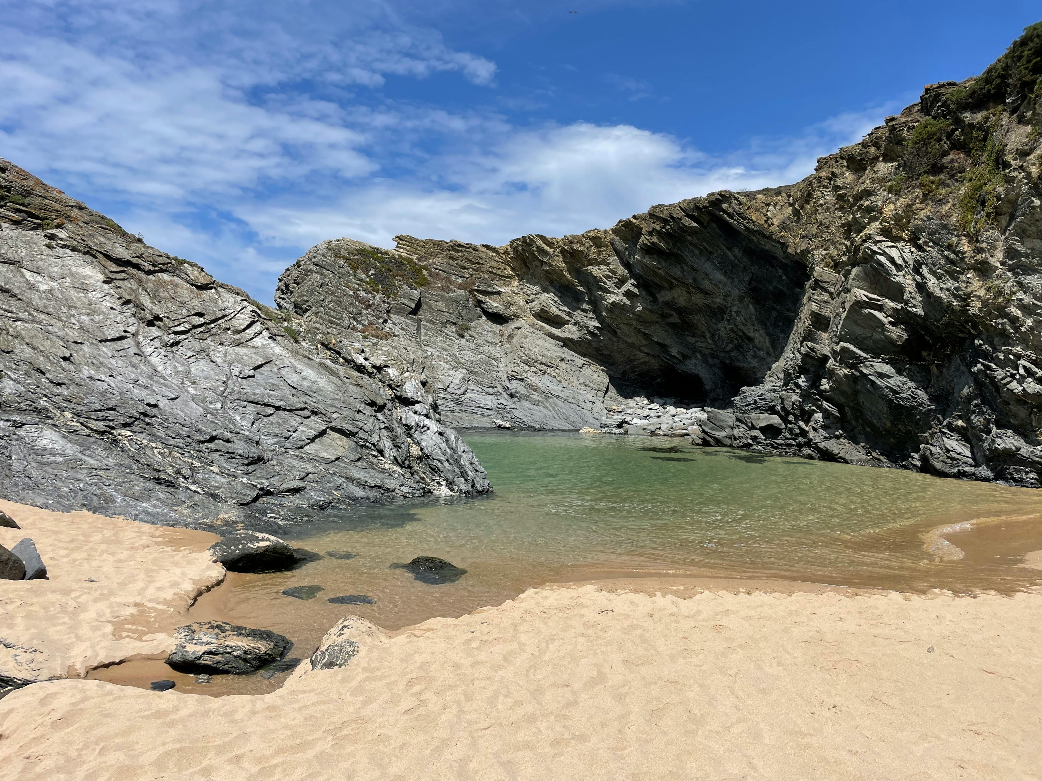 Lagoon and Beach Surrounded by Rock Formation · Free Stock Photo