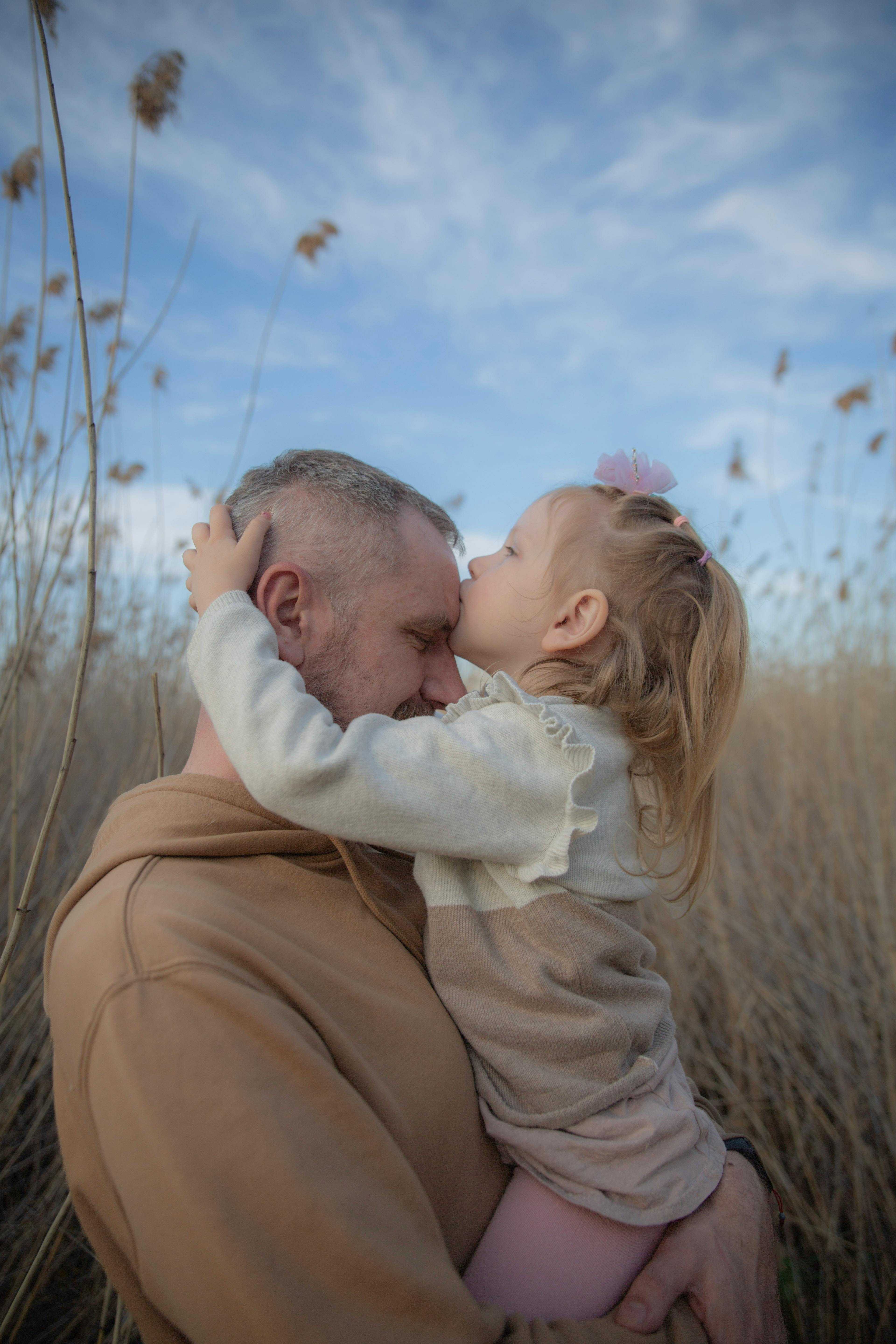 Father Hugging Daughter · Free Stock Photo