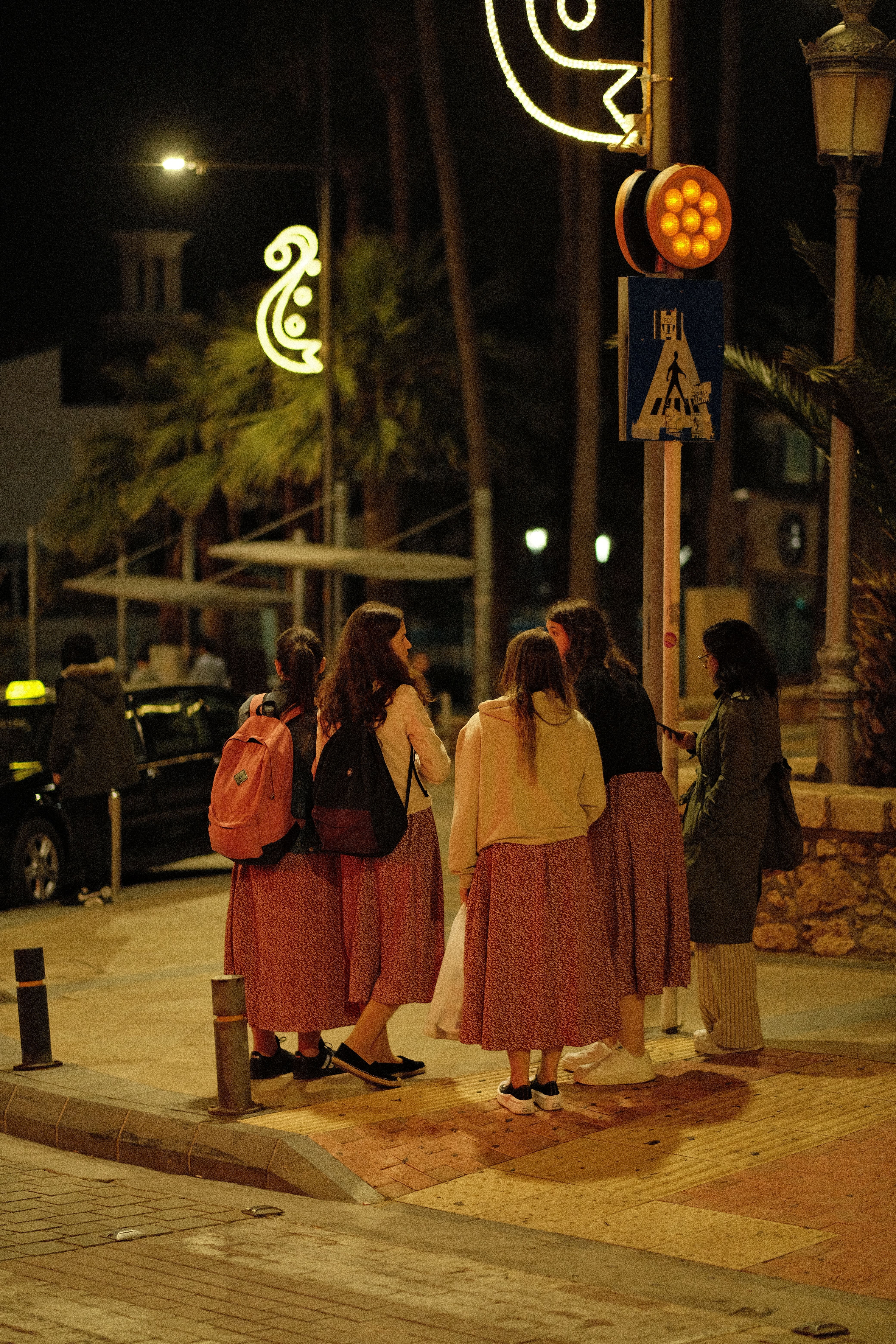 Friends Talking on Sidewalk at Night · Free Stock Photo
