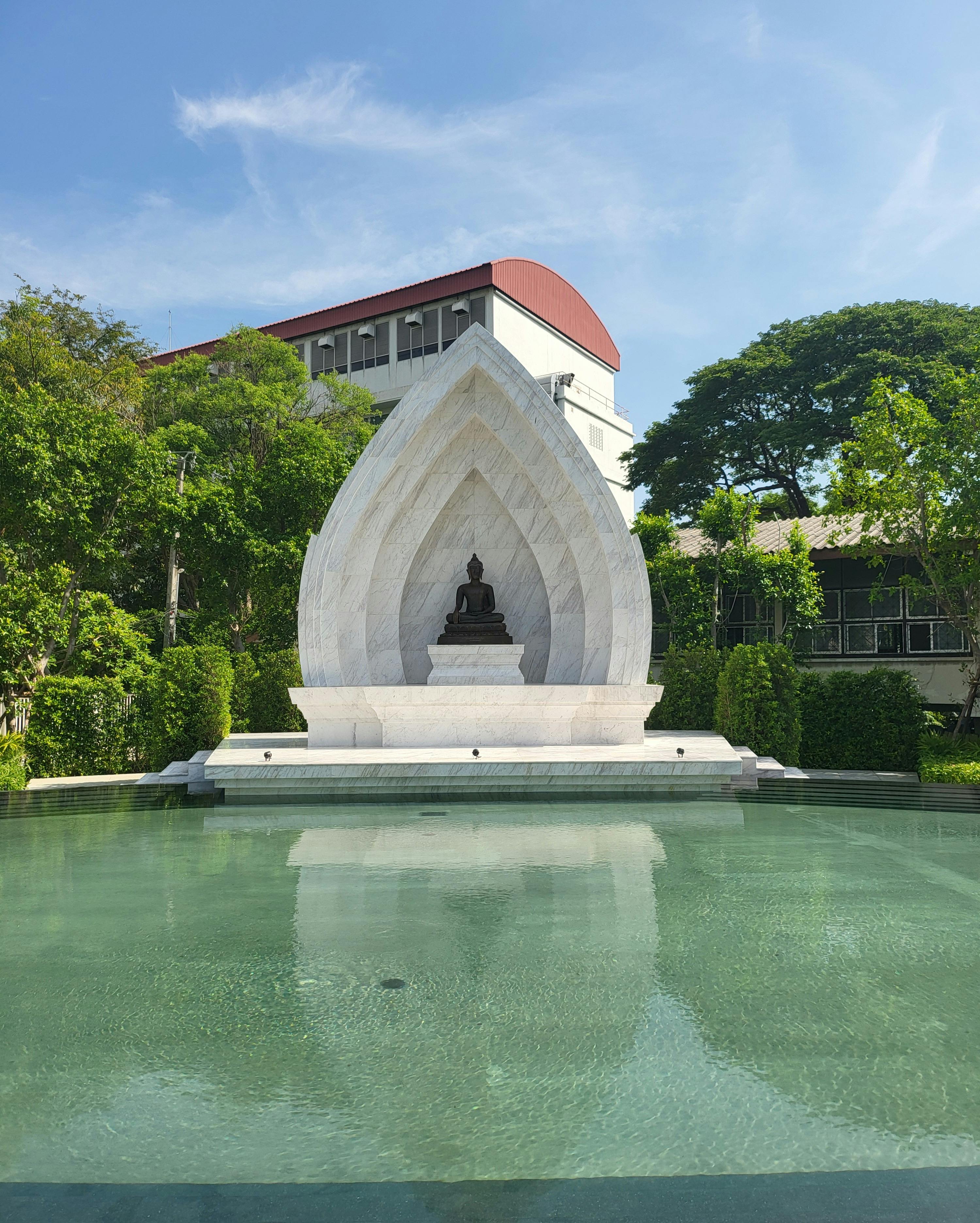 Buddha Statue in White Marble Shrine on the Edge of the Pool · Free ...