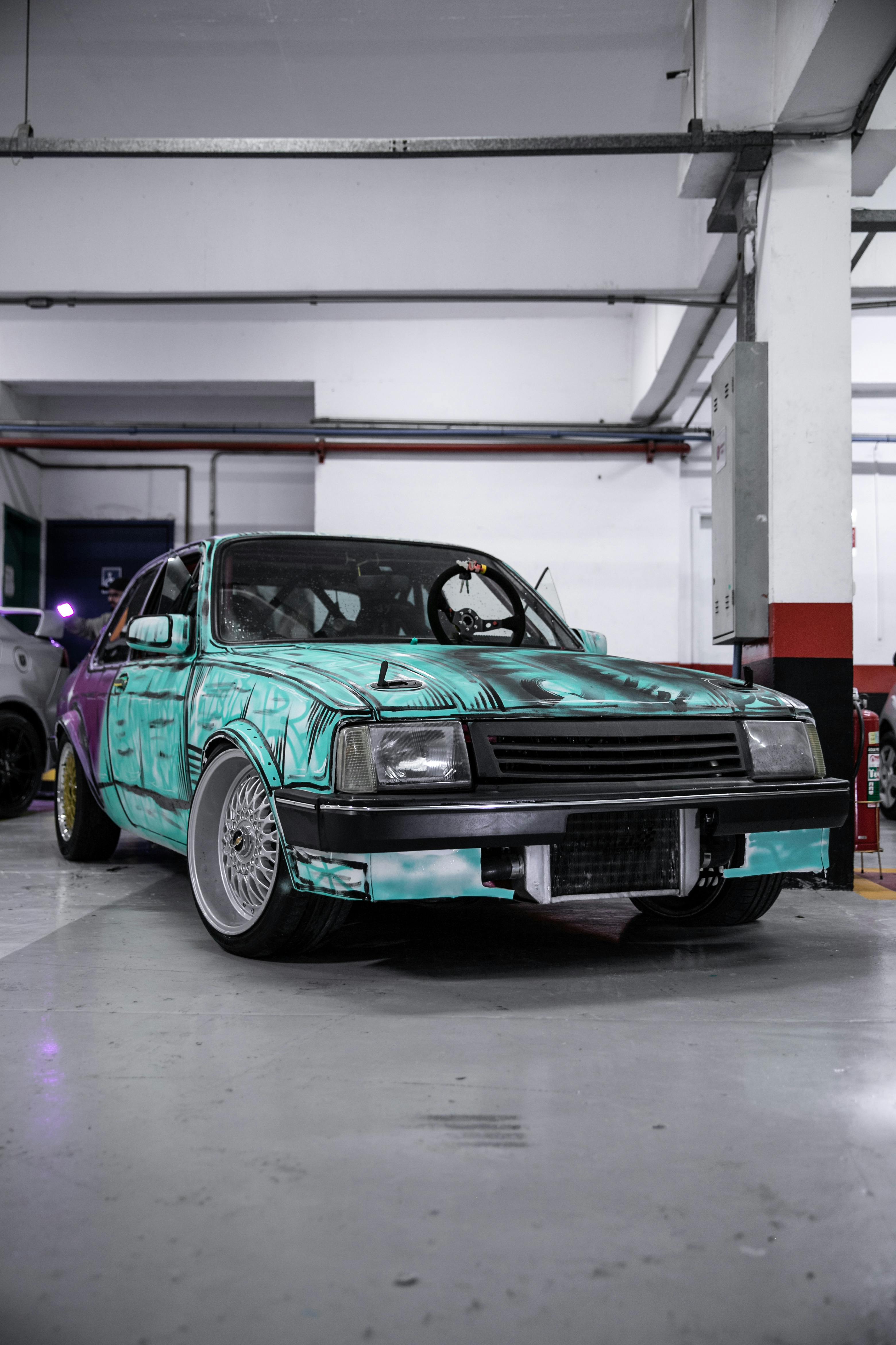 Vintage Chevrolet Chevette Car in a Garage · Free Stock Photo