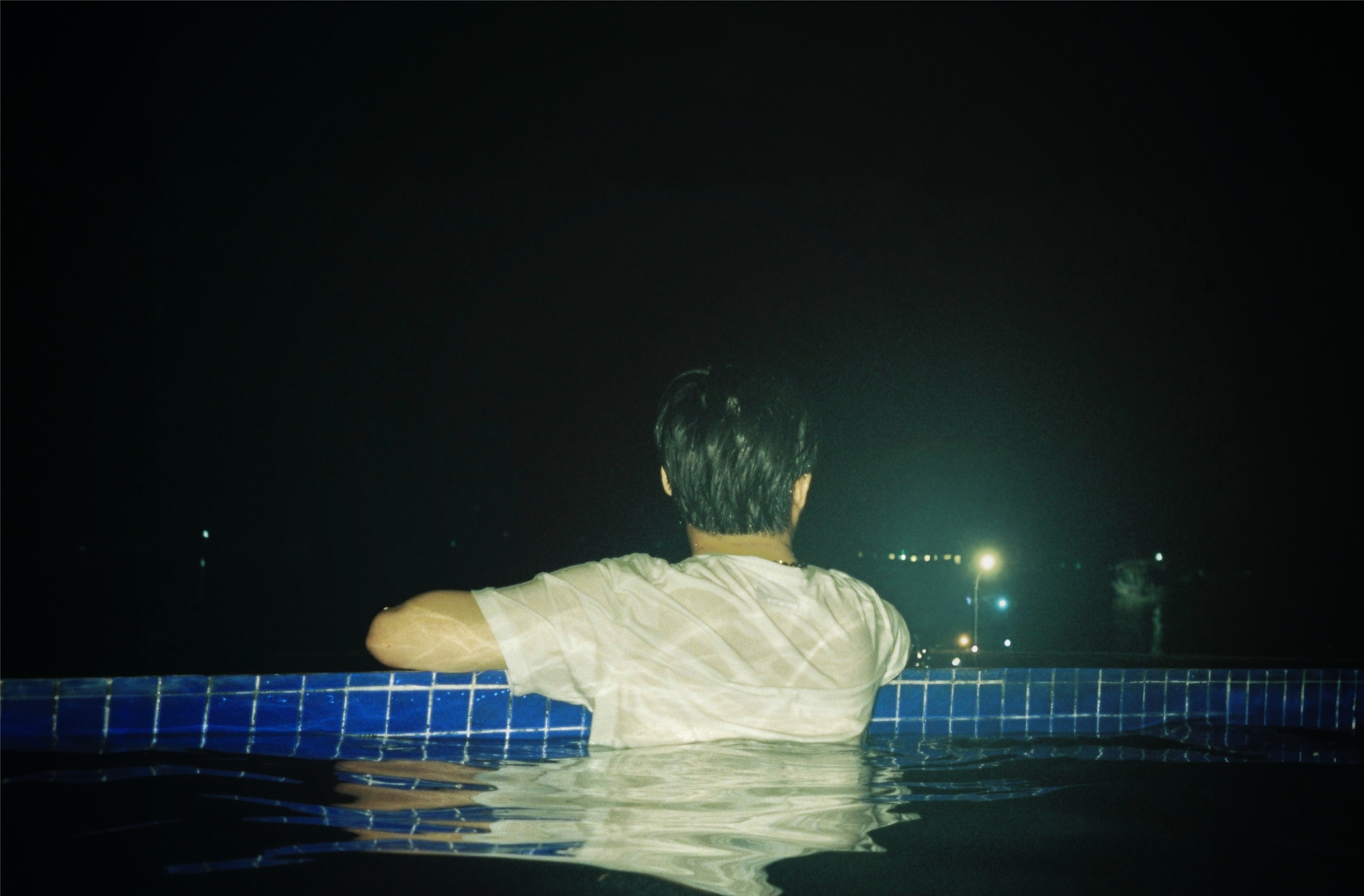 Man in Wet T-shirt in Swimming Pool · Free Stock Photo