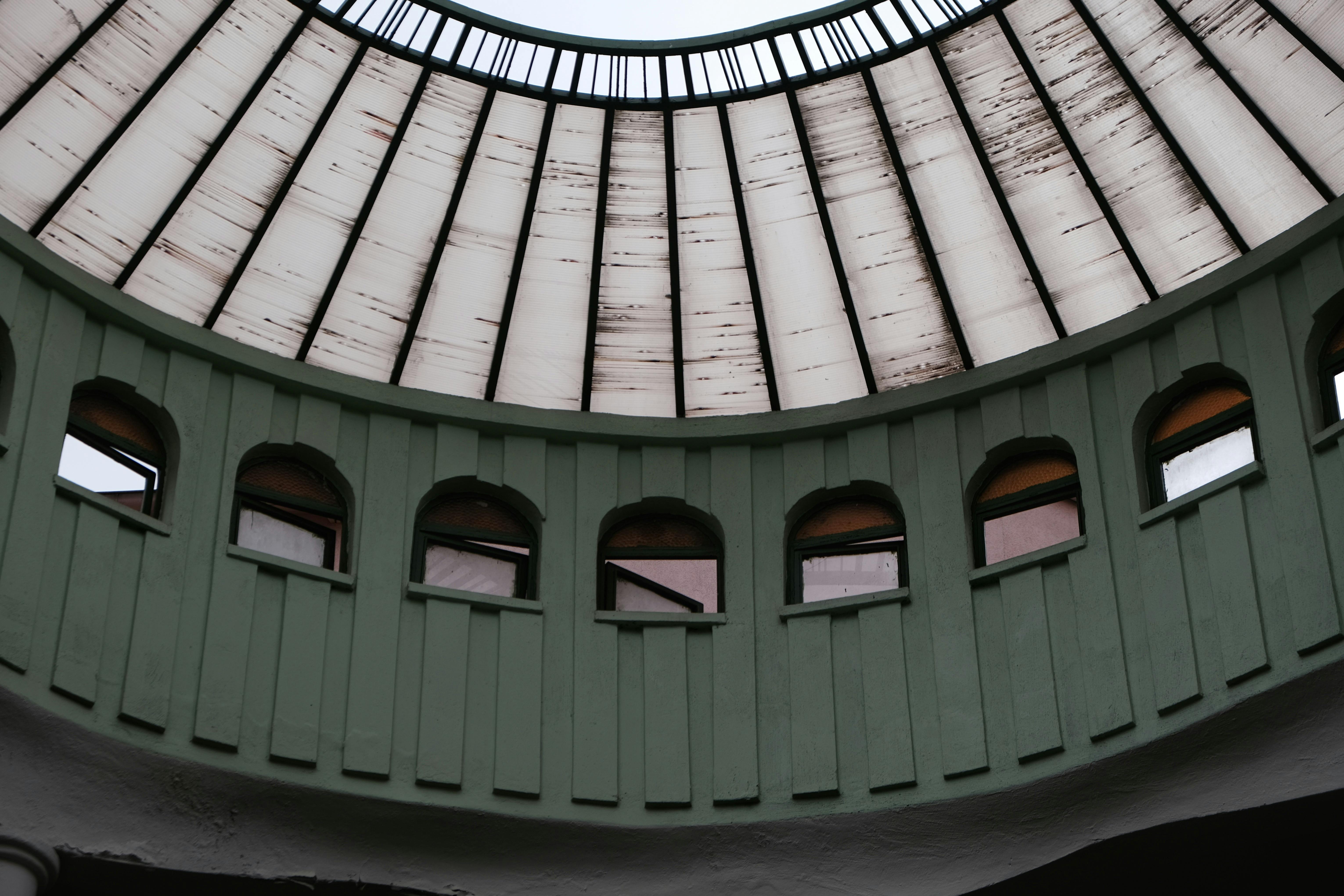 Bending Green Wall with Windows · Free Stock Photo