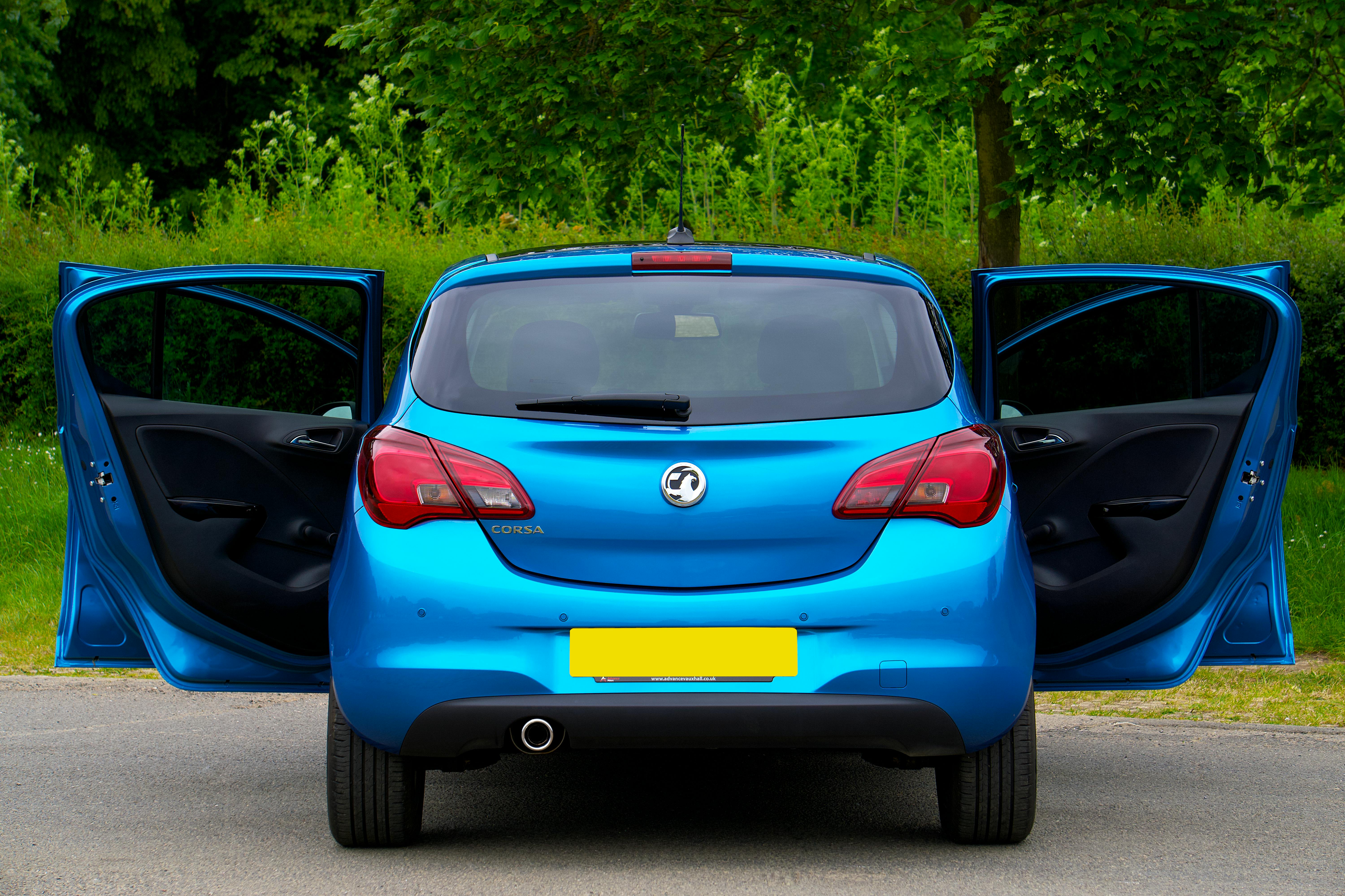 Back of Vauxhall Corsa with Open Doors · Free Stock Photo