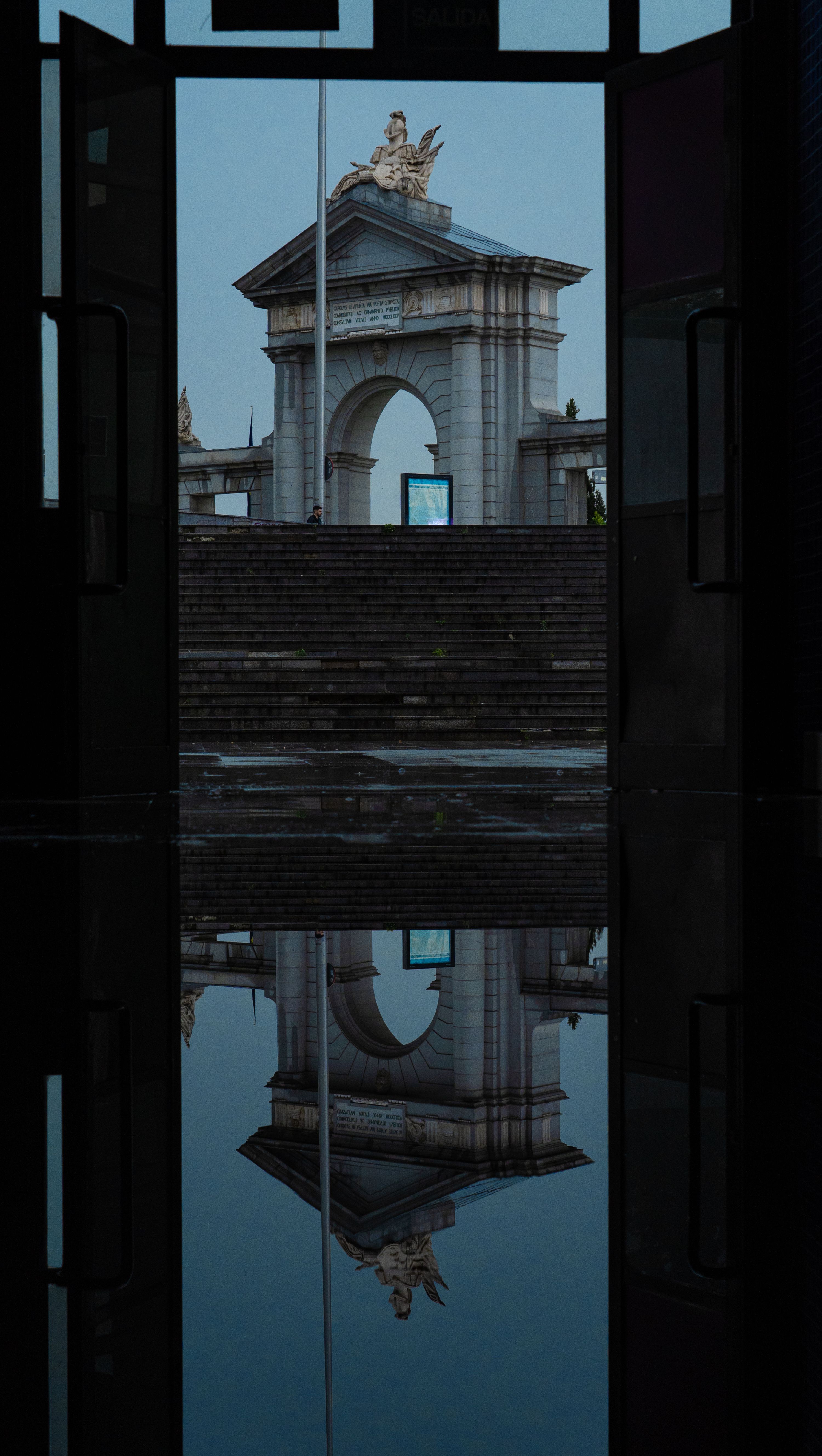 Reflection of an Arch in a Puddle · Free Stock Photo