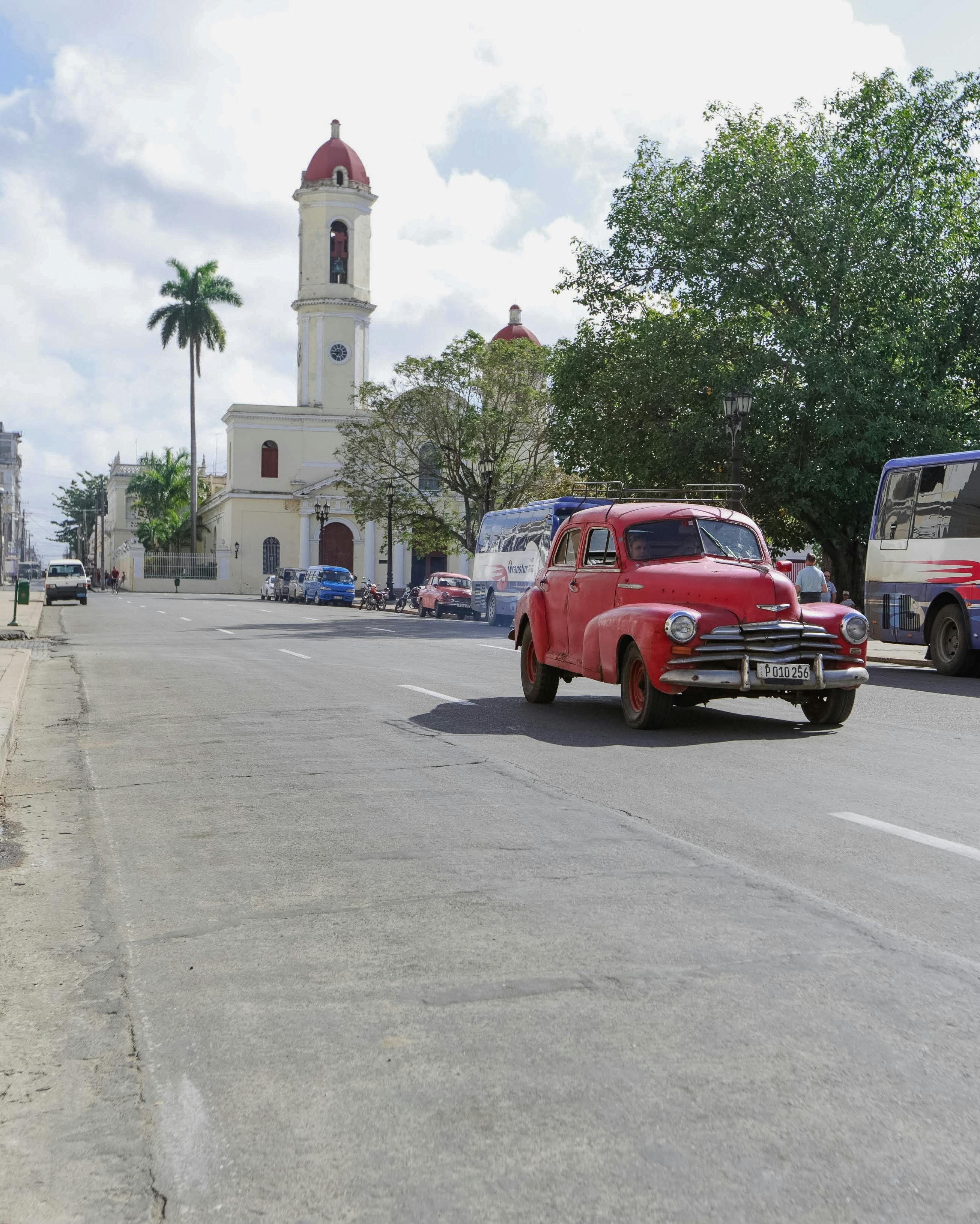 Retro Car Driving on City Street · Free Stock Photo