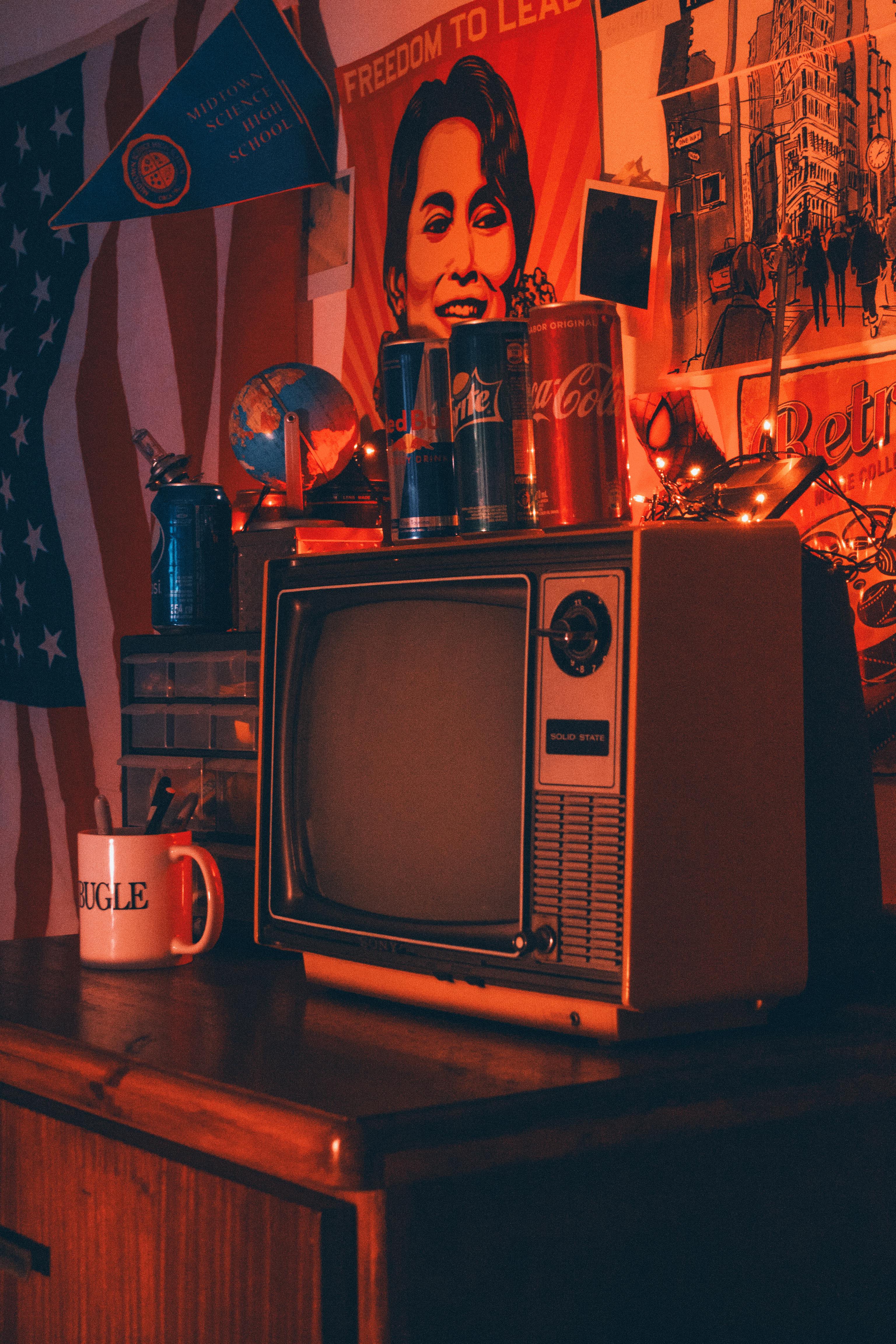 Drinks Cans on Retro TV in Dark Room · Free Stock Photo
