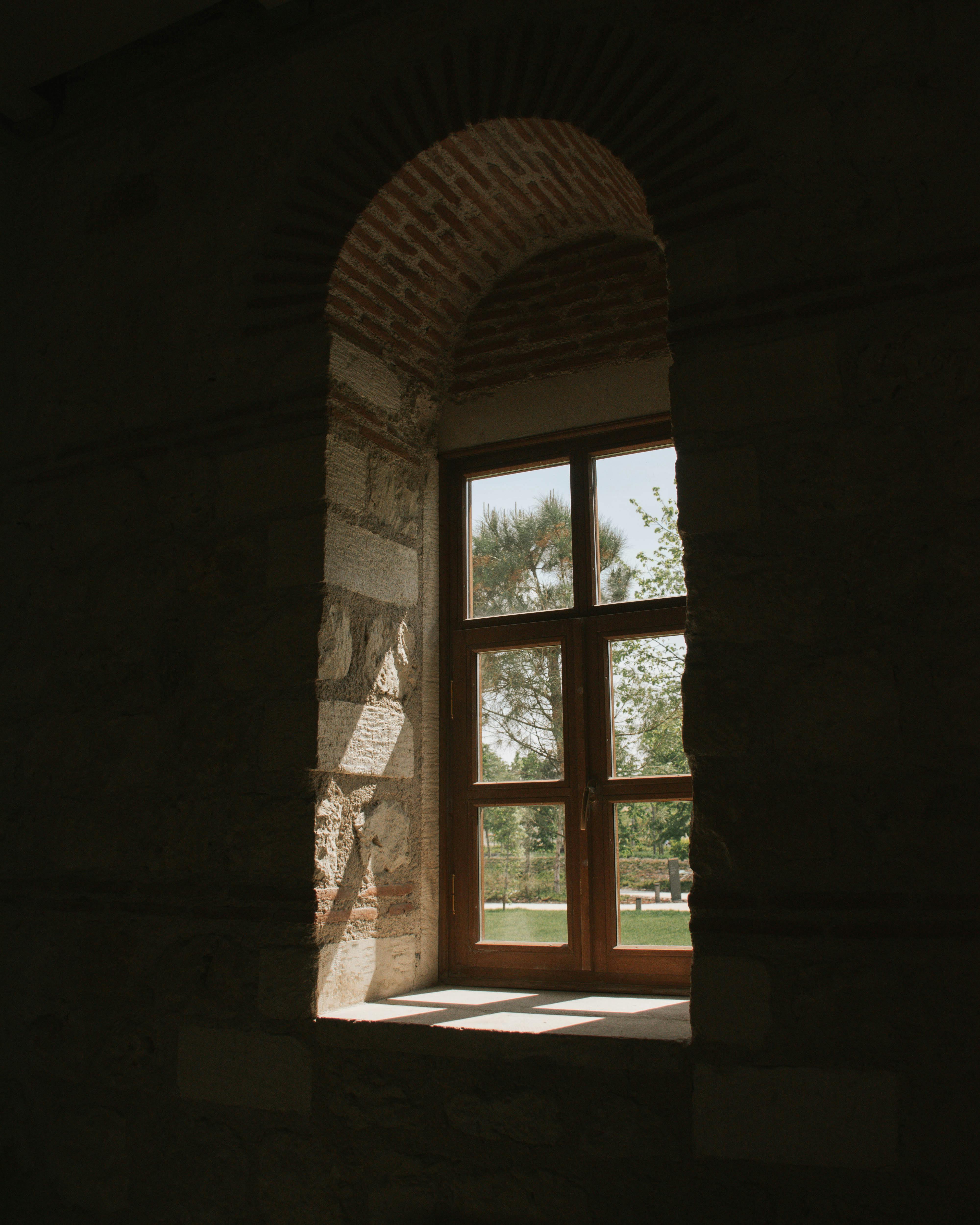 Sunlit Arched Window of an Old House with Thick Stone Block Walls ...