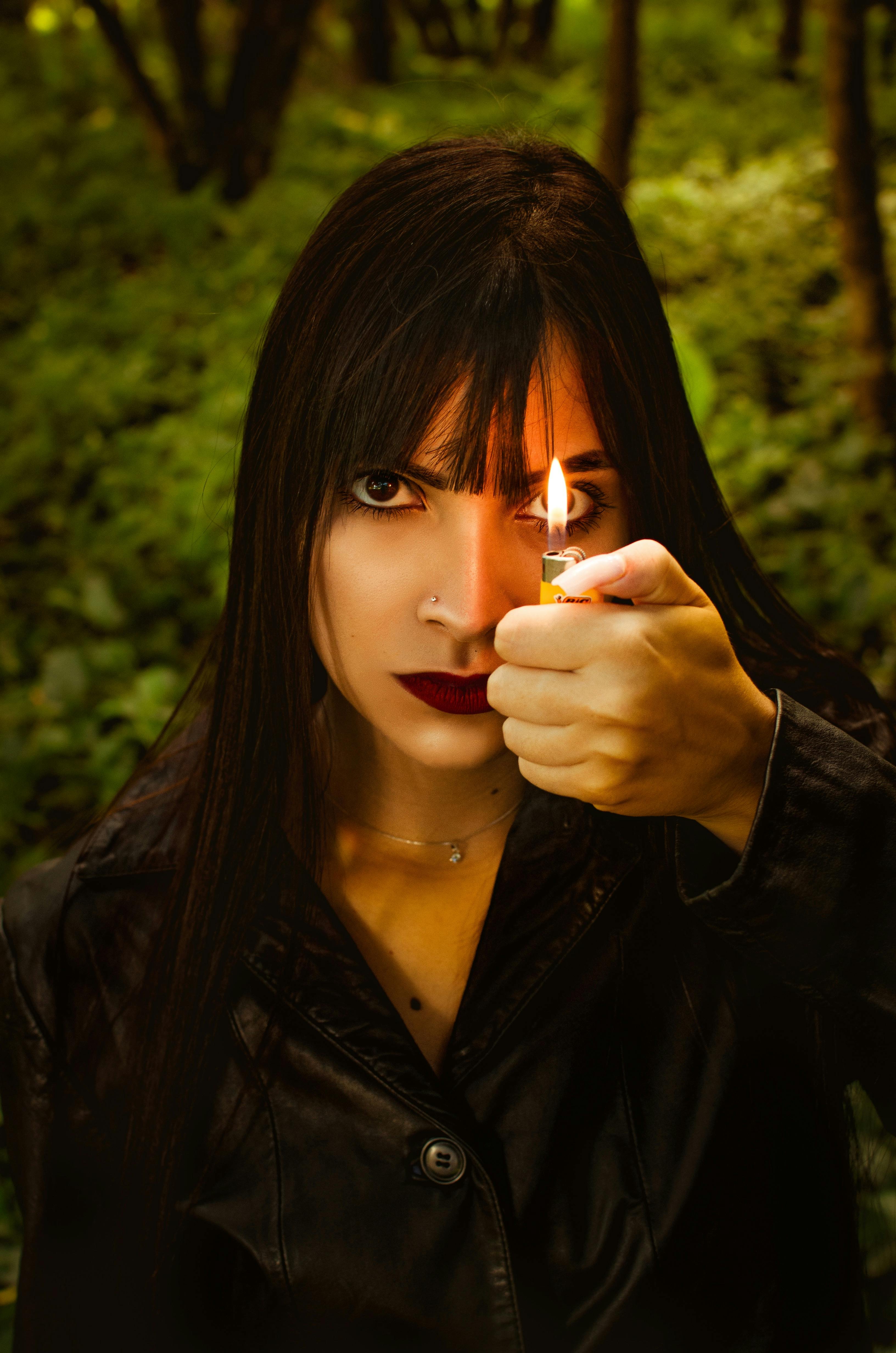 Portrait of a Woman with a Lighter · Free Stock Photo