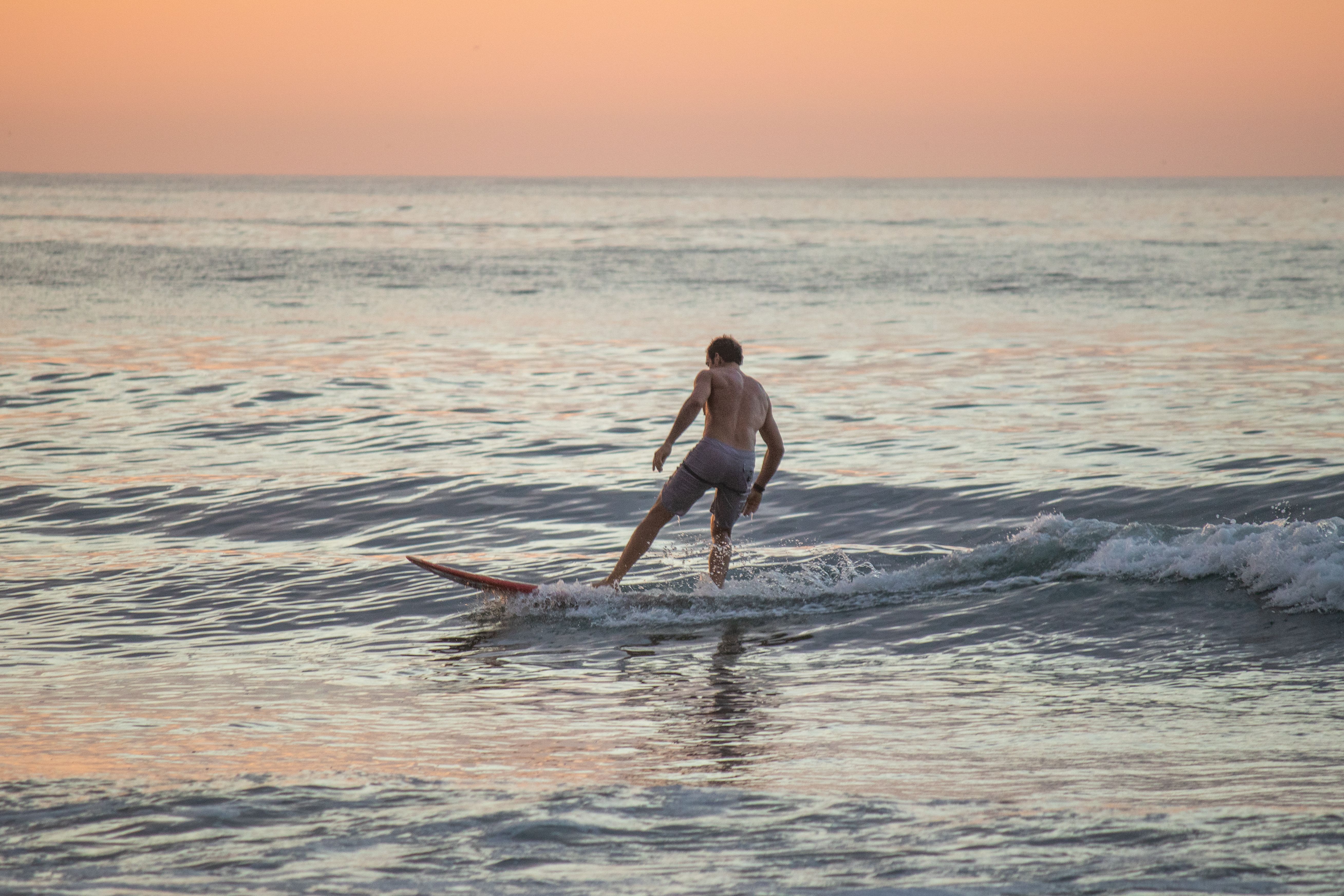 Man Surfing on Sea · Free Stock Photo