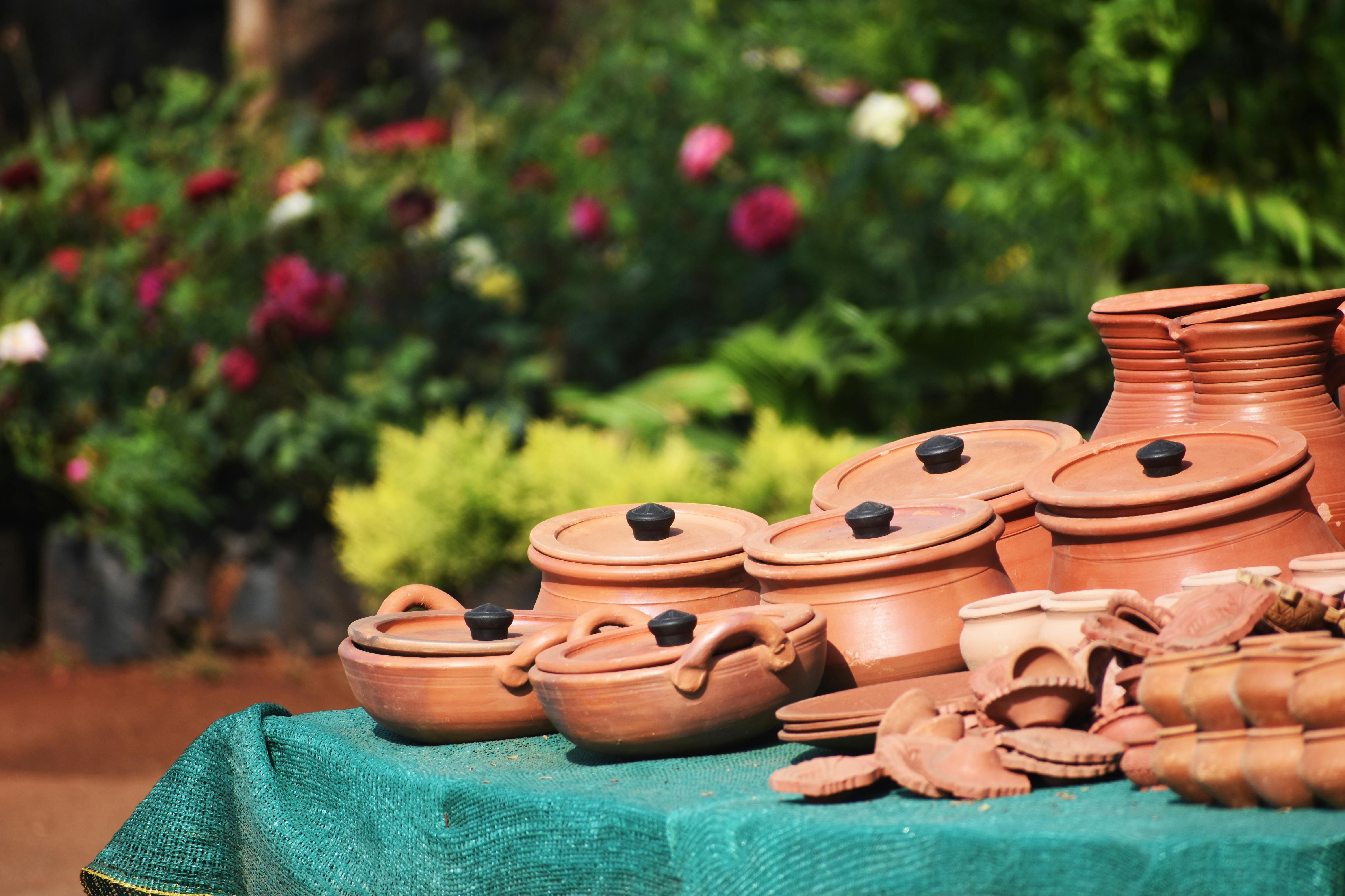 Table Full of Clay Pots Bowls and Plates · Free Stock Photo