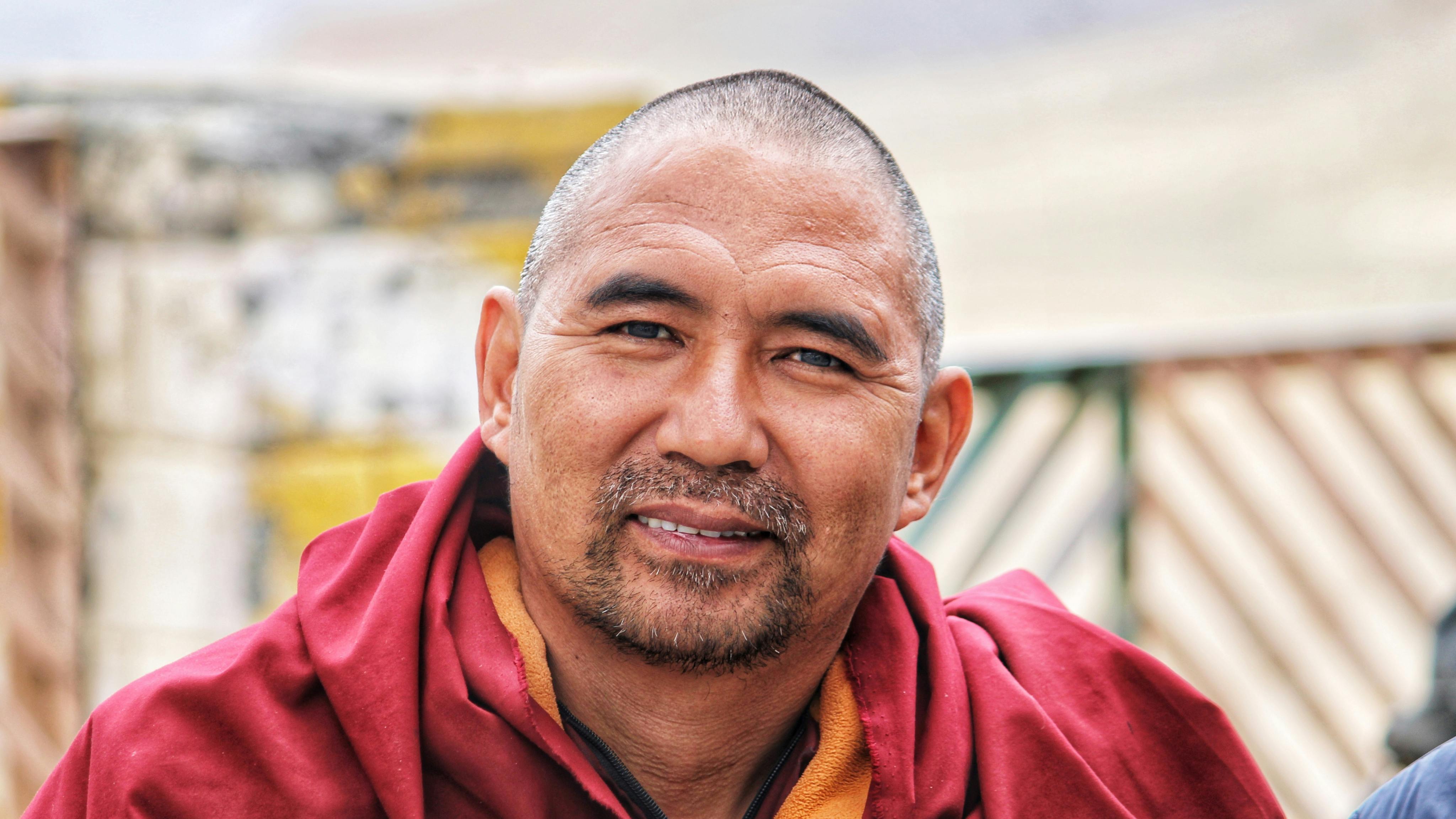 Portrait of a Smiling Monk · Free Stock Photo