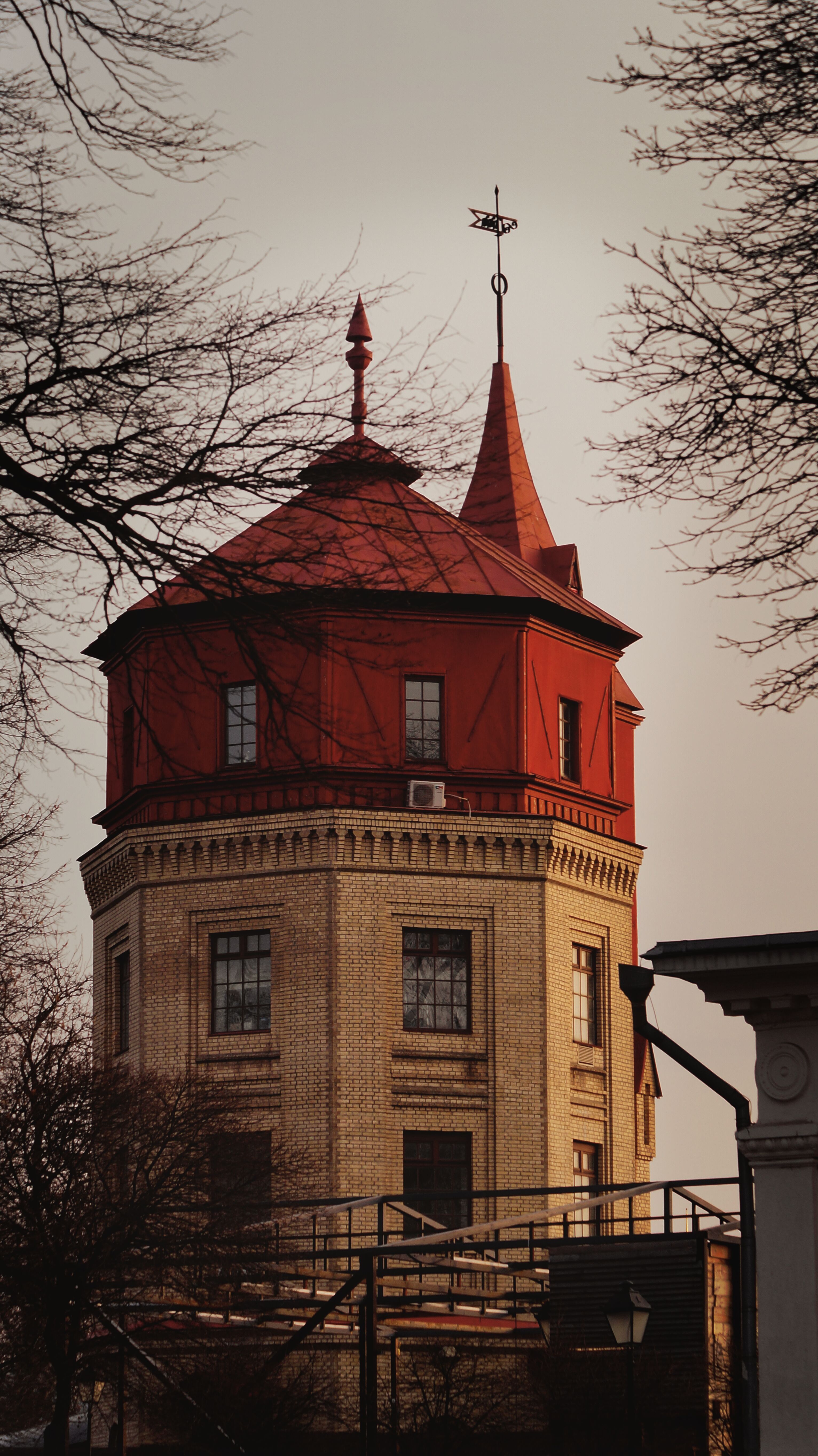 Photo of a Red and Yellow Tower with Pointed Roof · Free Stock Photo