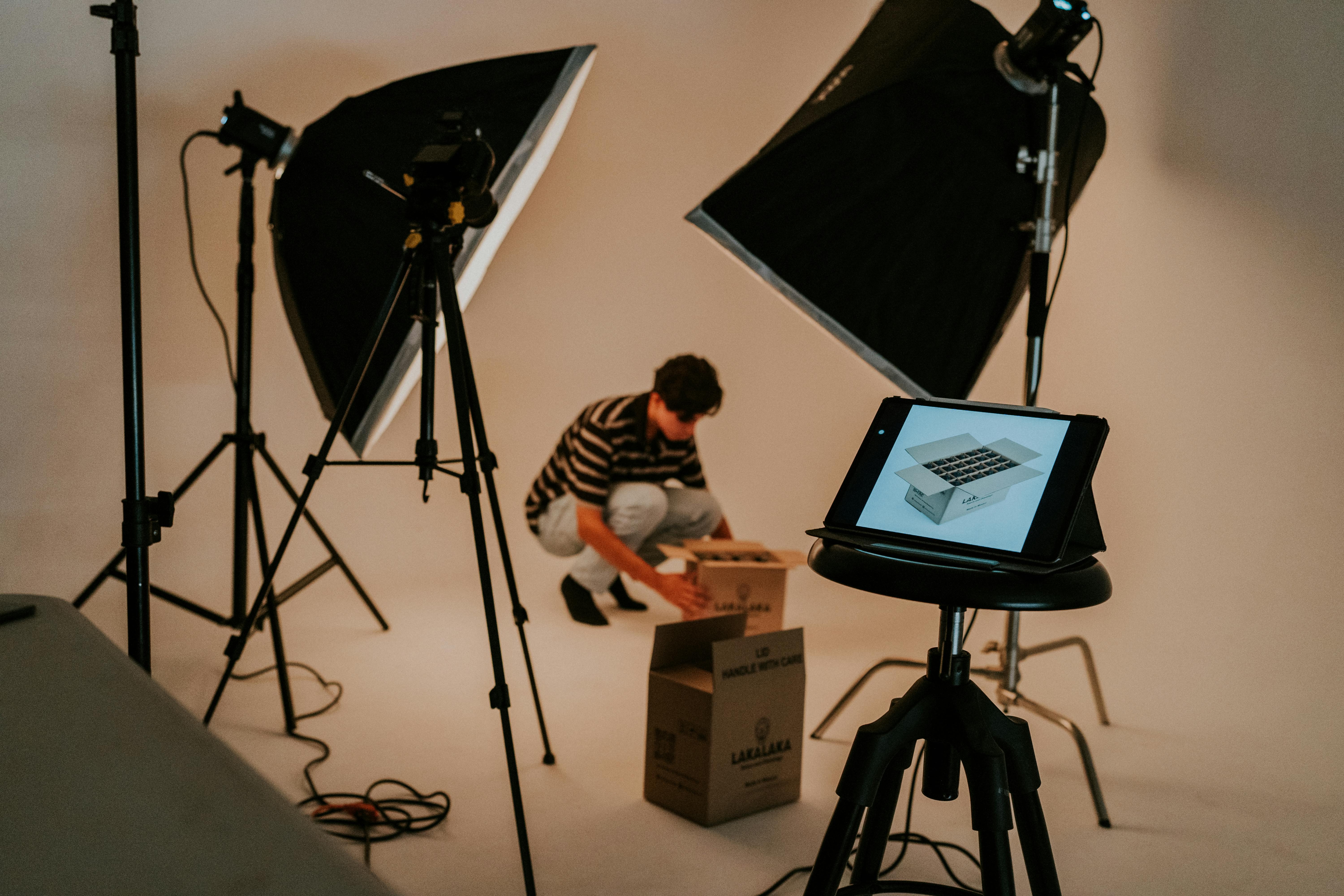 Screen, Reflector and Man Working at Photo Studio · Free Stock Photo