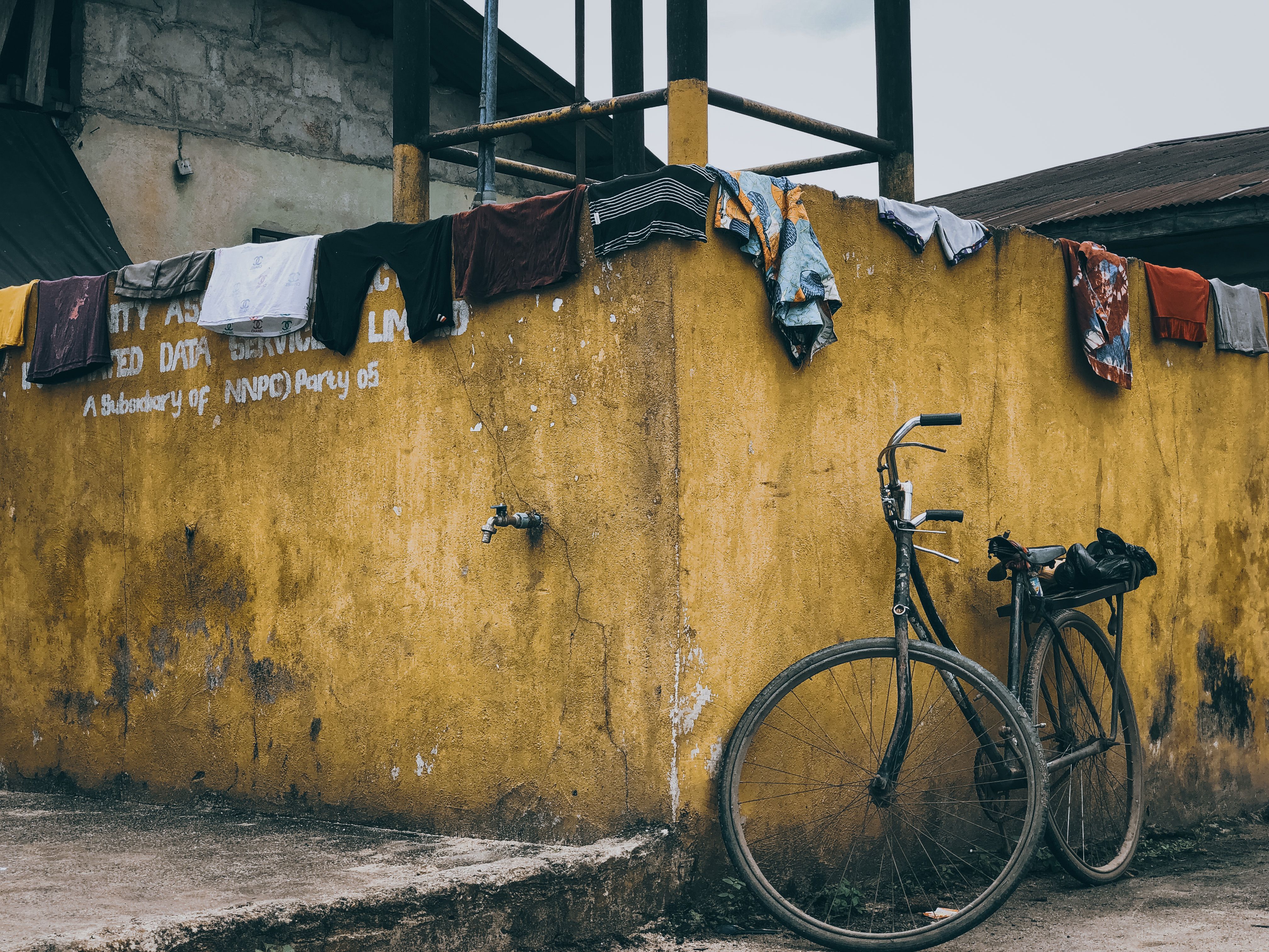 Clothes Drying on Yellow Wall · Free Stock Photo
